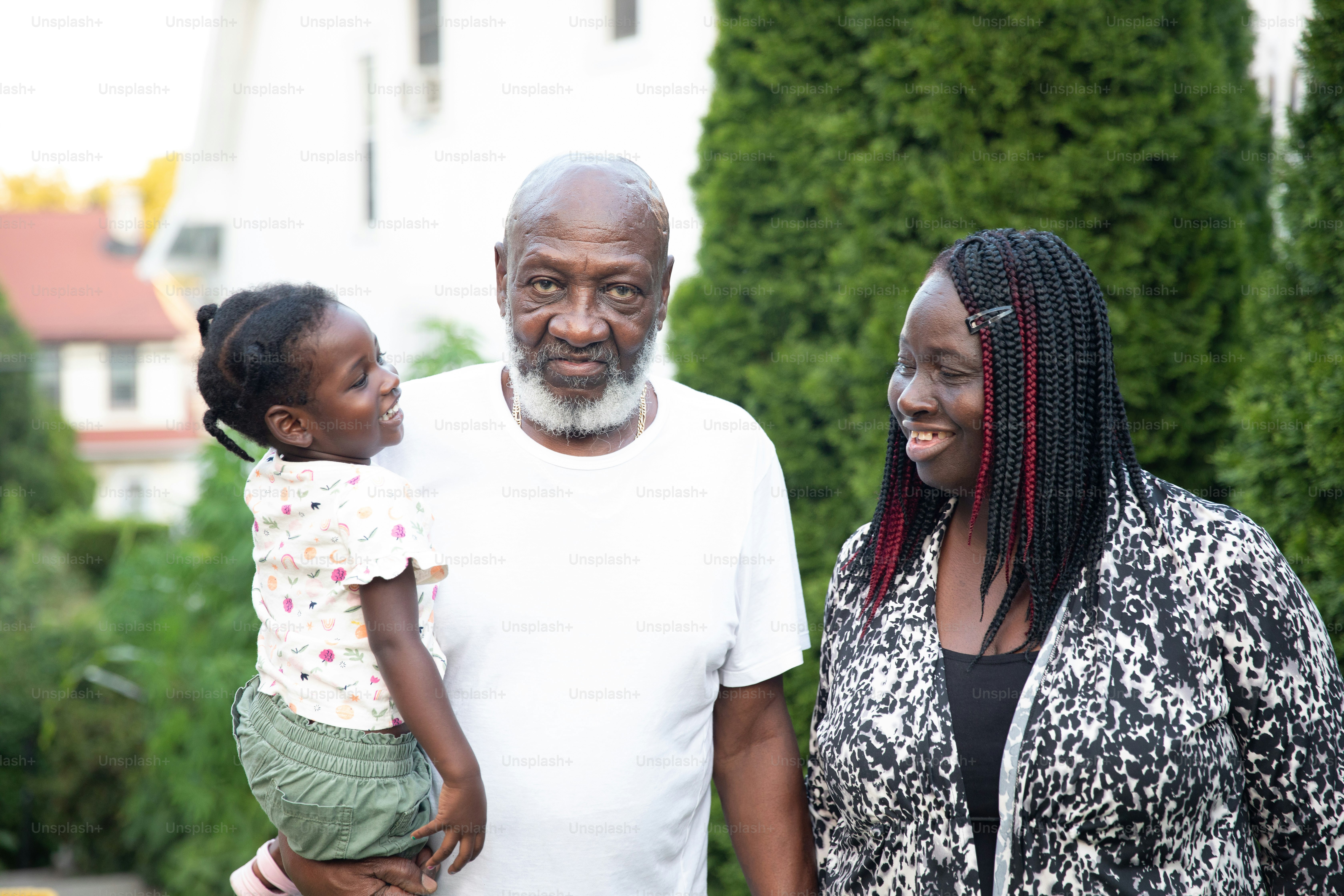 A woman and a child are laughing together photo – Multi generational ...