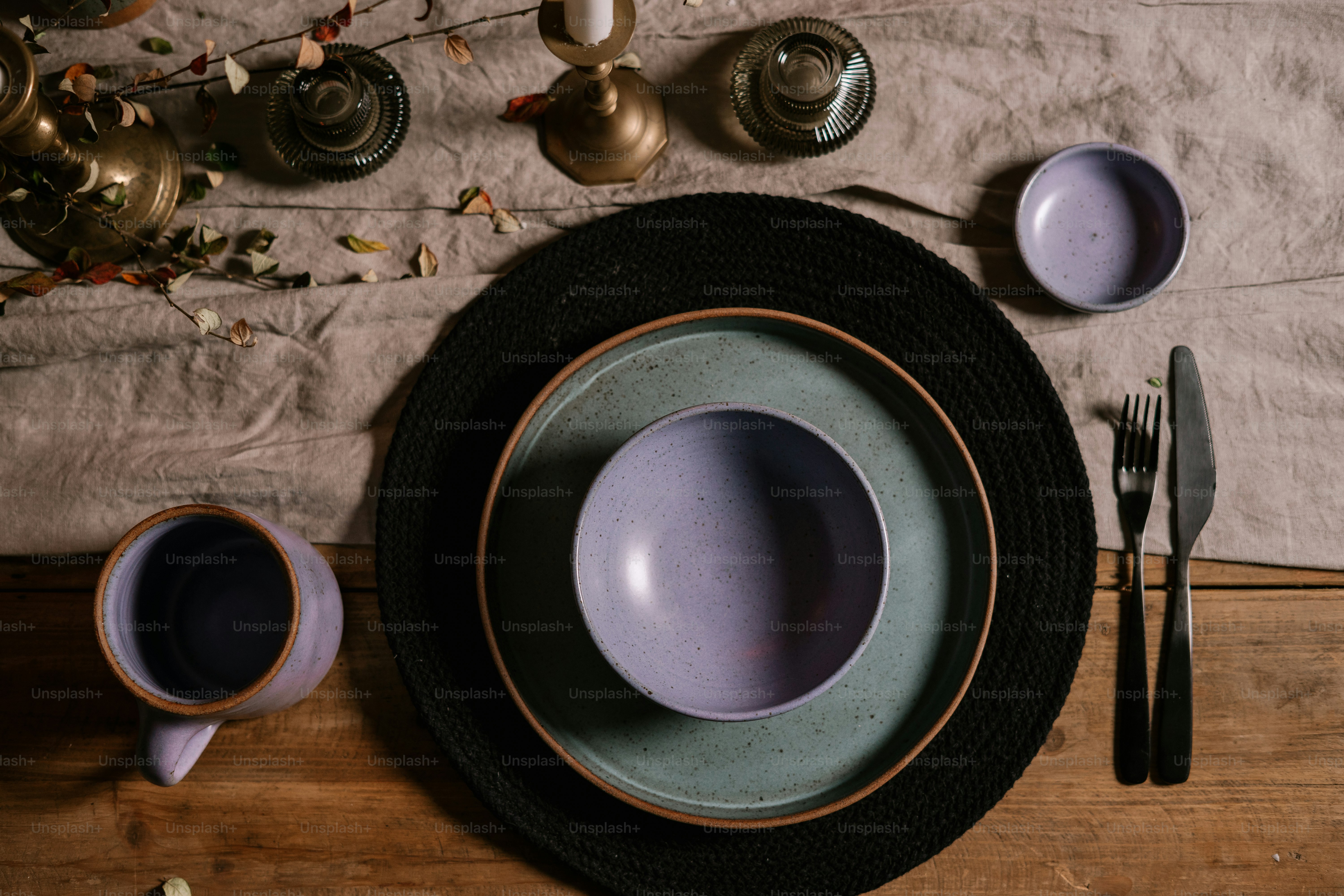 A table set with plates, cups, and utensils photo – Cutlery Image on ...