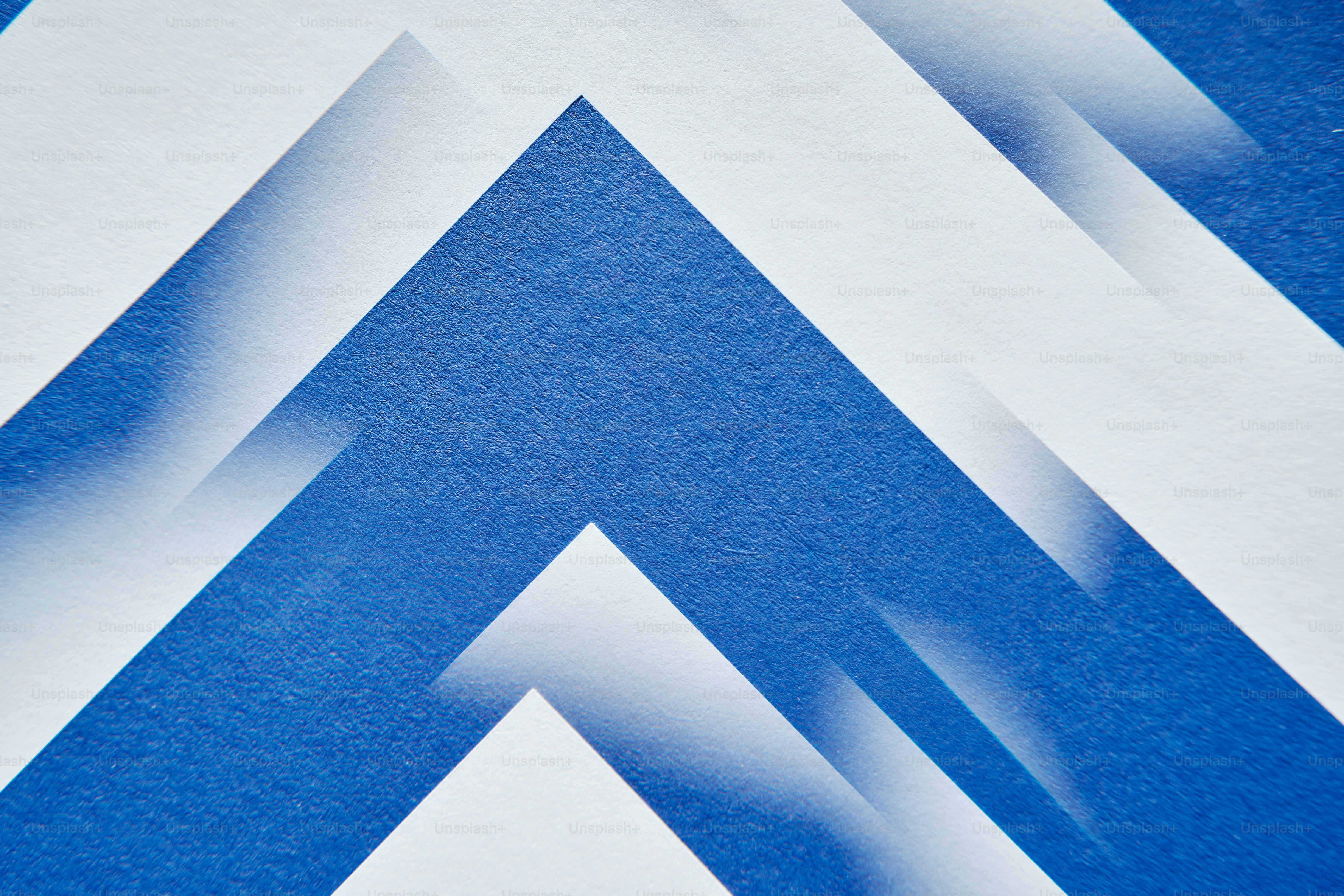 A picture of a blue and white triangle photo – Paper Image on Unsplash