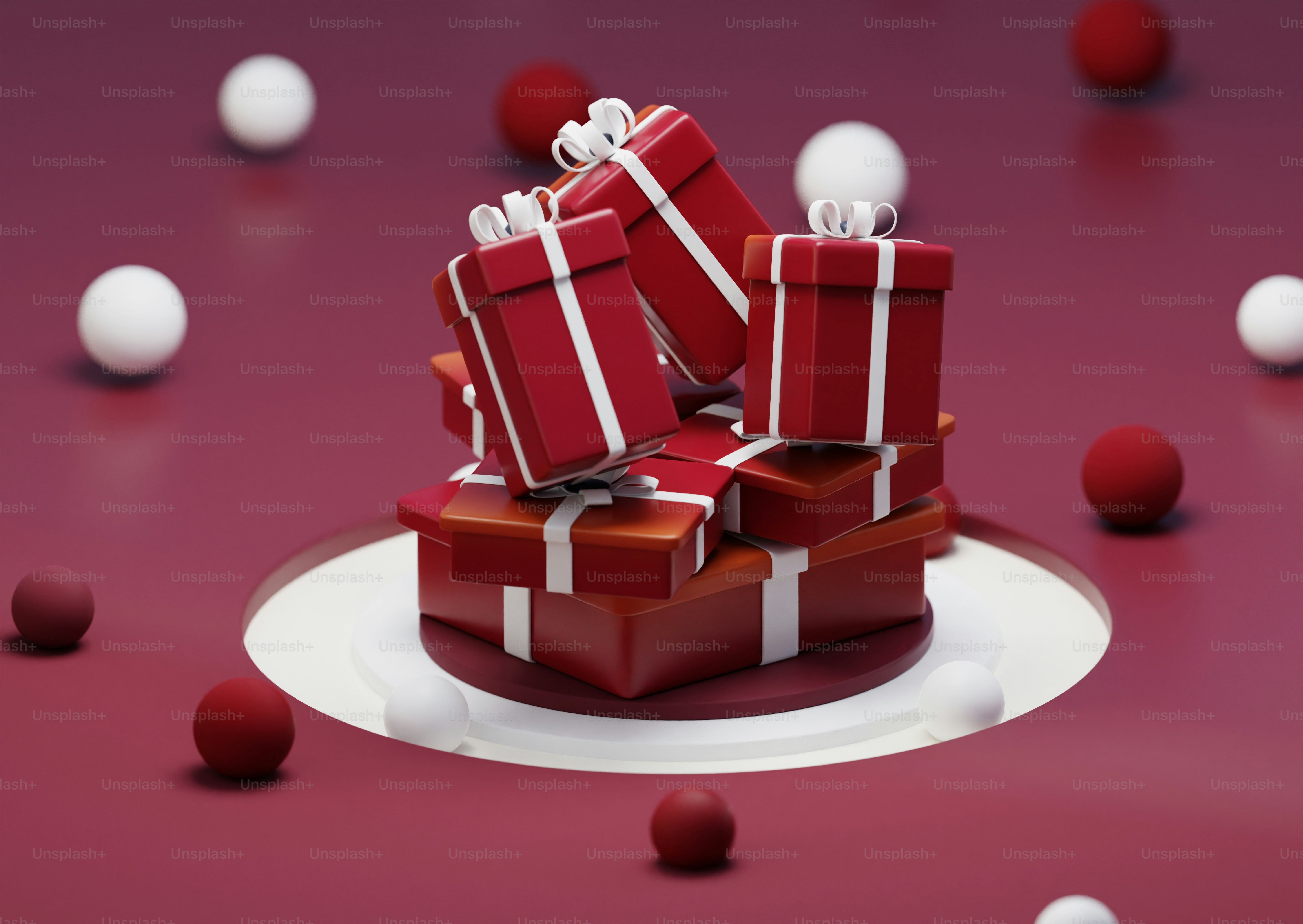 A pile of red presents sitting on top of a white plate photo ...