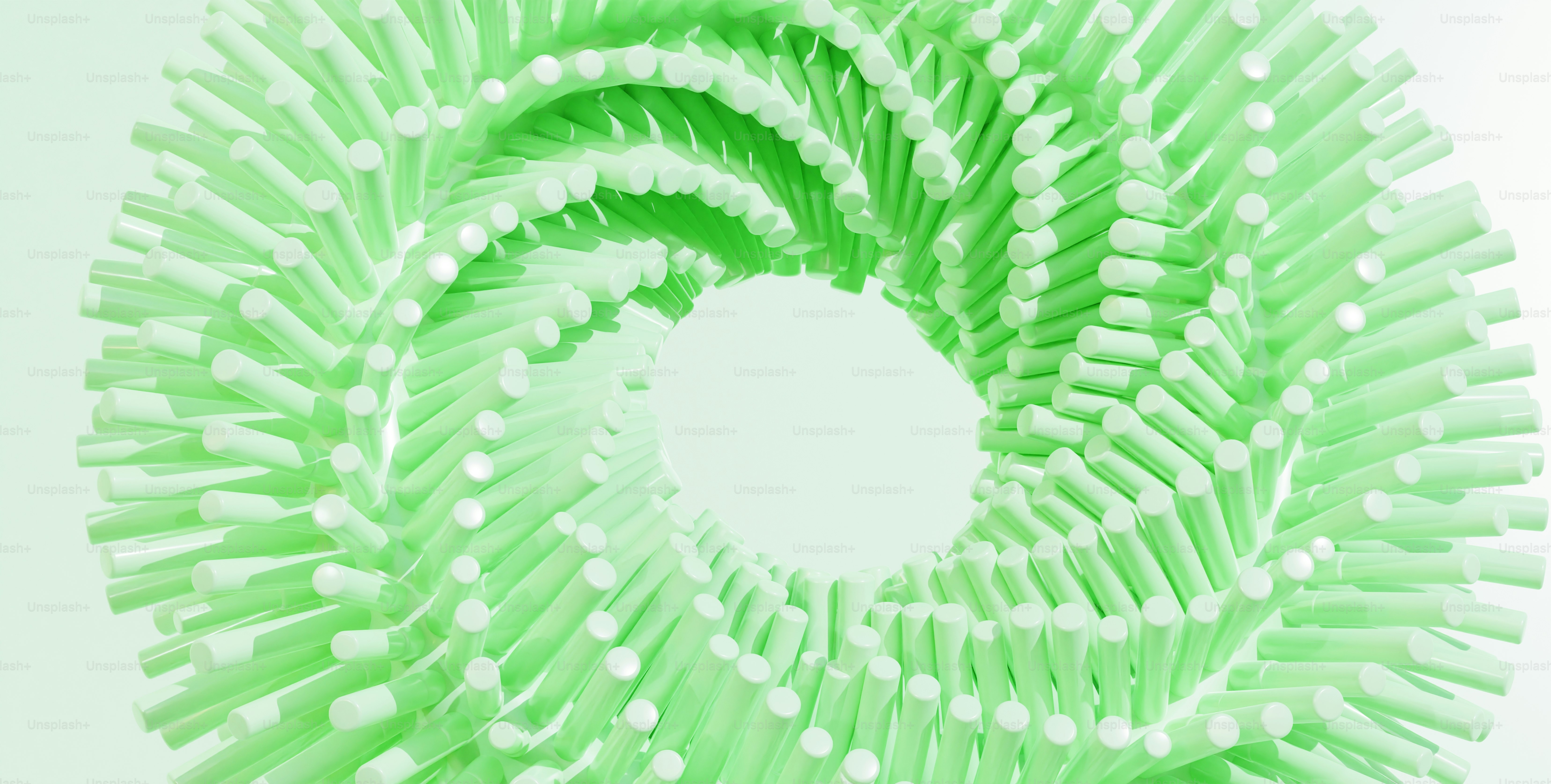 A circular object made out of toothbrushes on a white surface photo ...