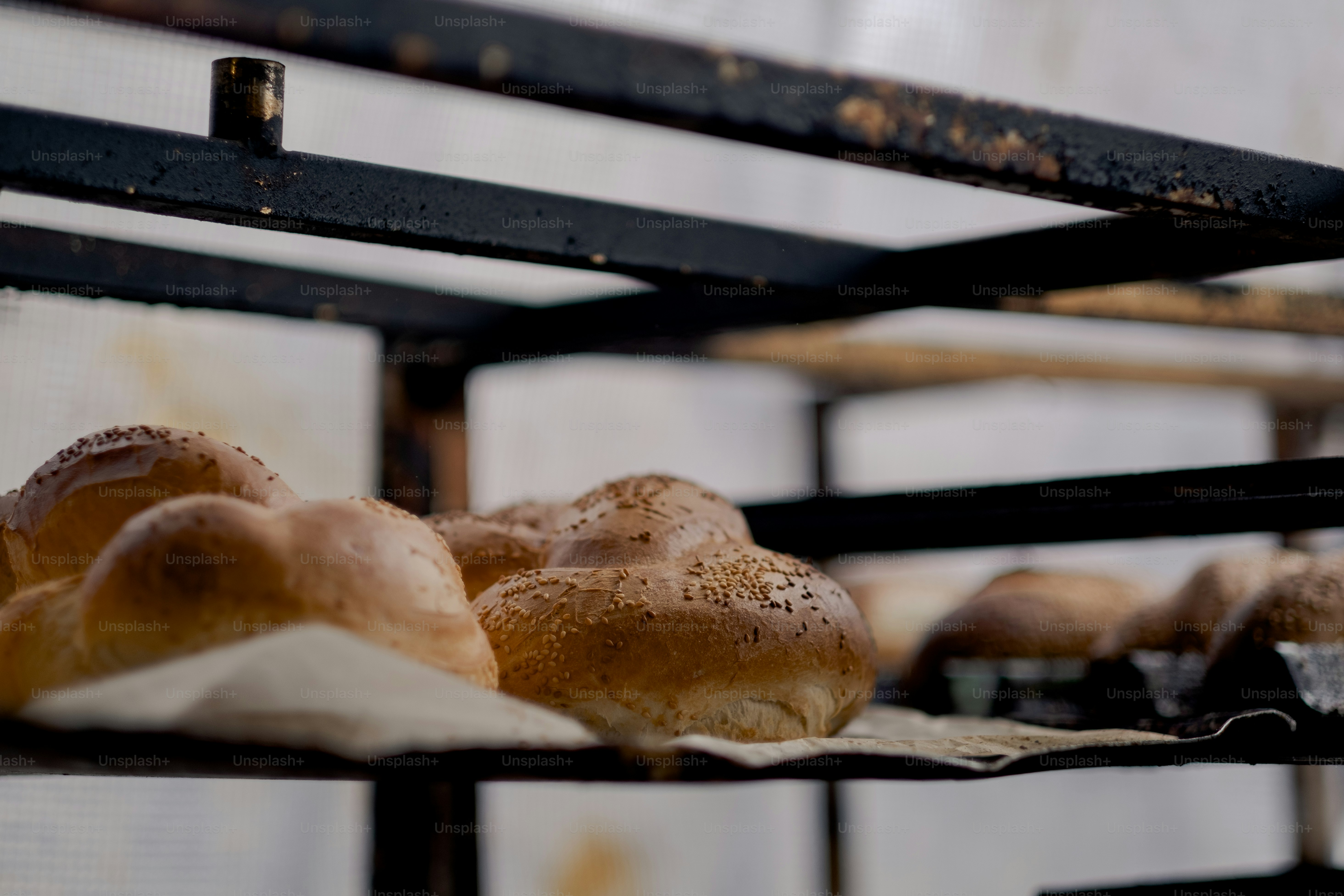 A bunch of breads that are on a rack photo – Jerusalem Image on Unsplash