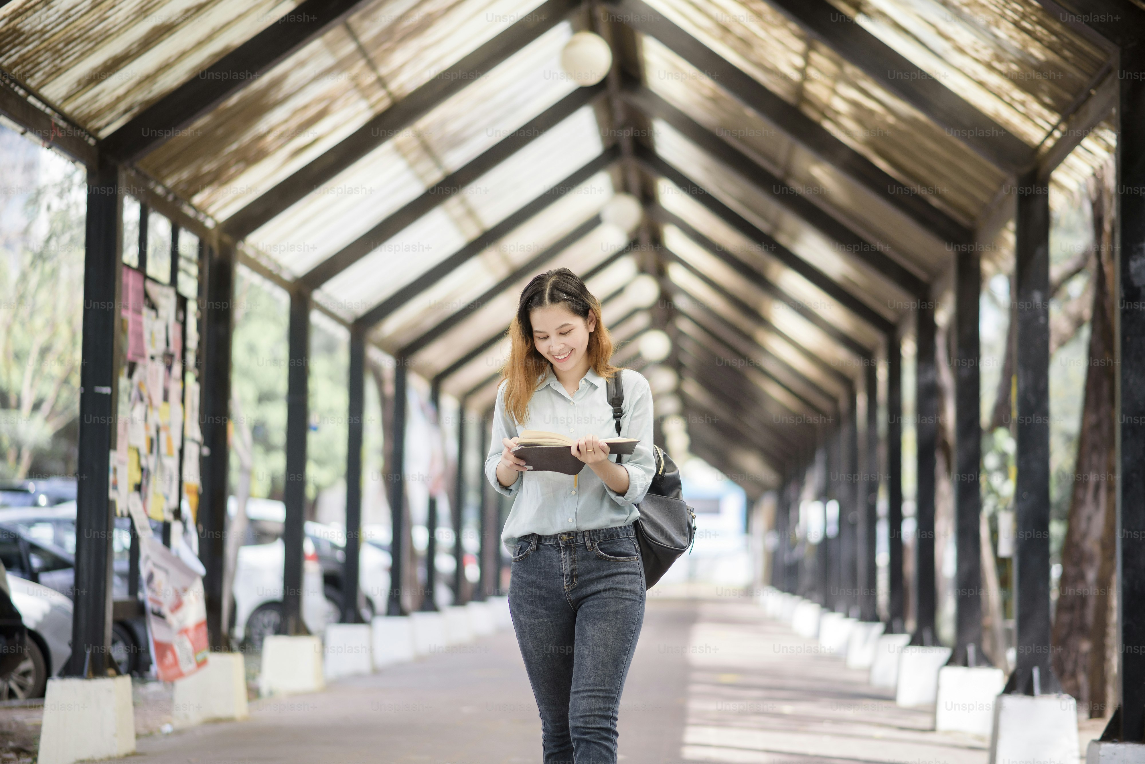 Happy young Asian University student. photo – Reading Image on Unsplash