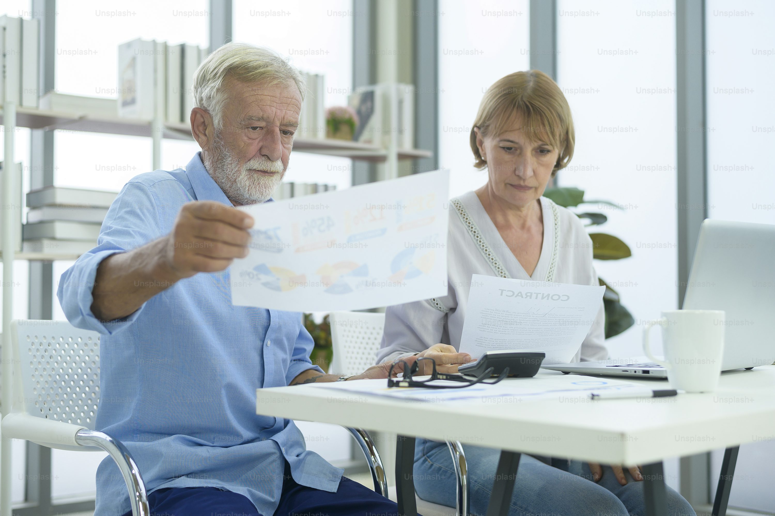 Caucasian senior Business people working and brainstorming in modern ... Caucasian senior Business people working and brainstorming in modern ...
