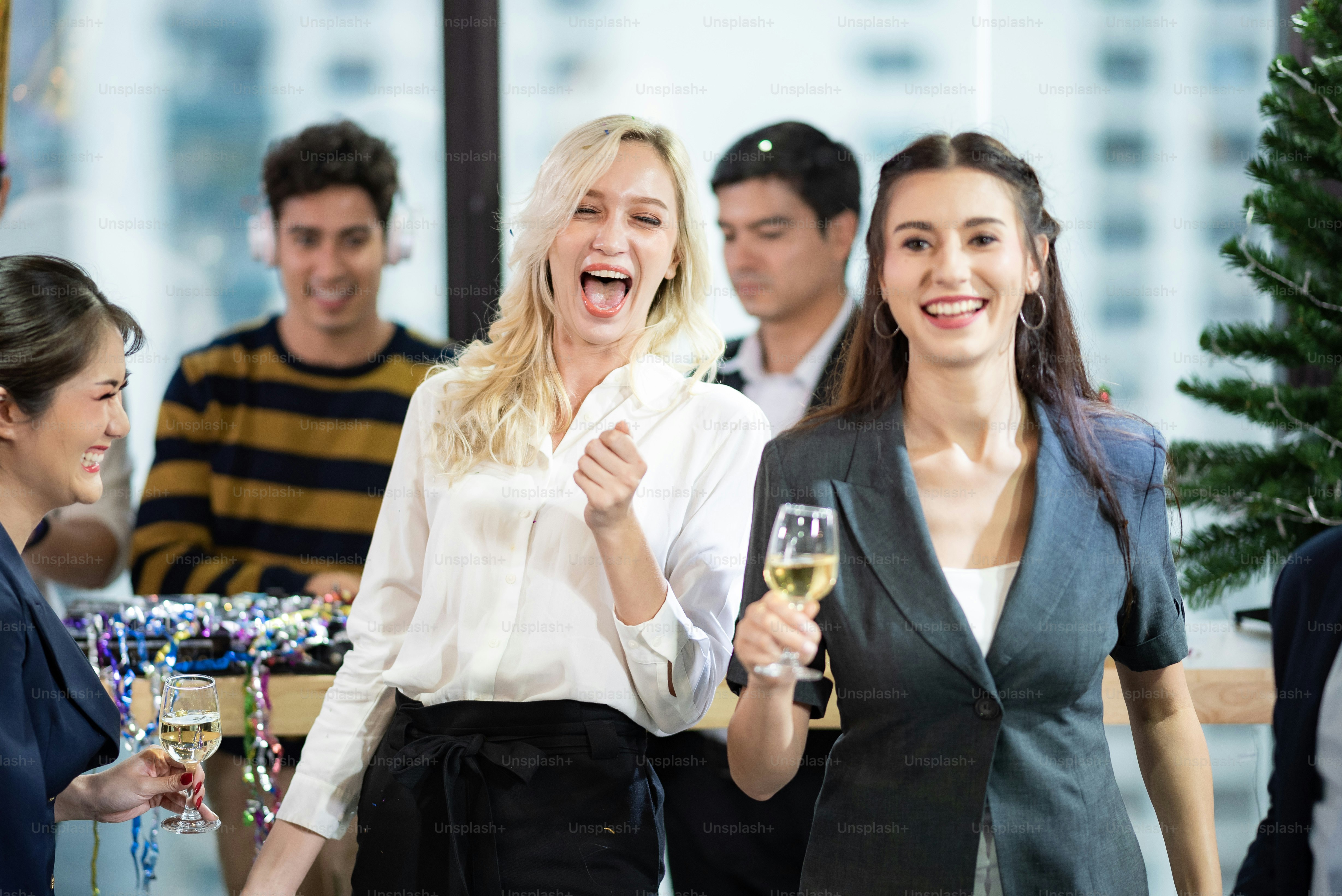 Toast to success. Group of business people toasting with champagne and ...