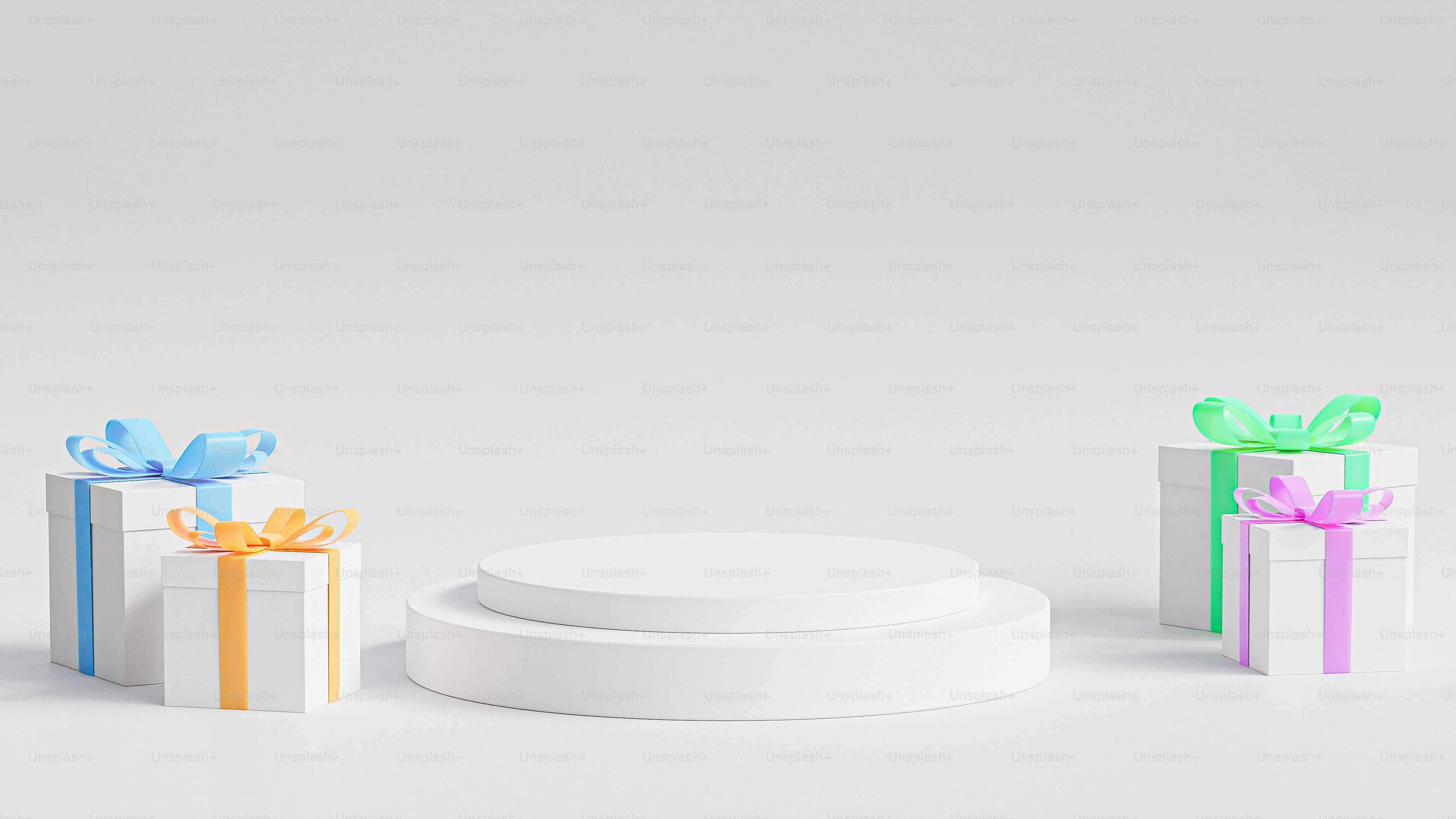 A white box with a blue bow and a white box with a yellow bow photo ...