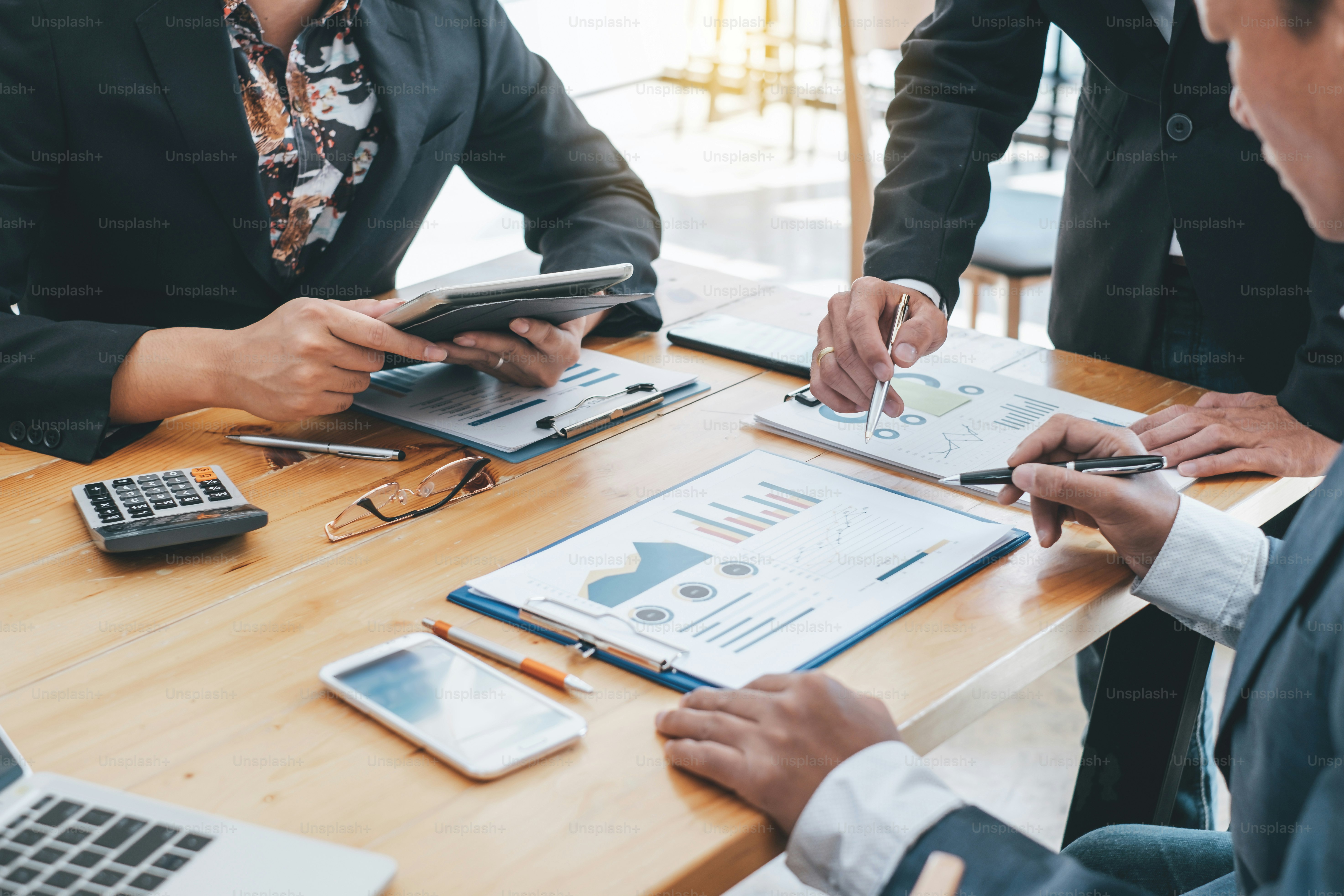 Business people meeting together about investment and the discussion ...