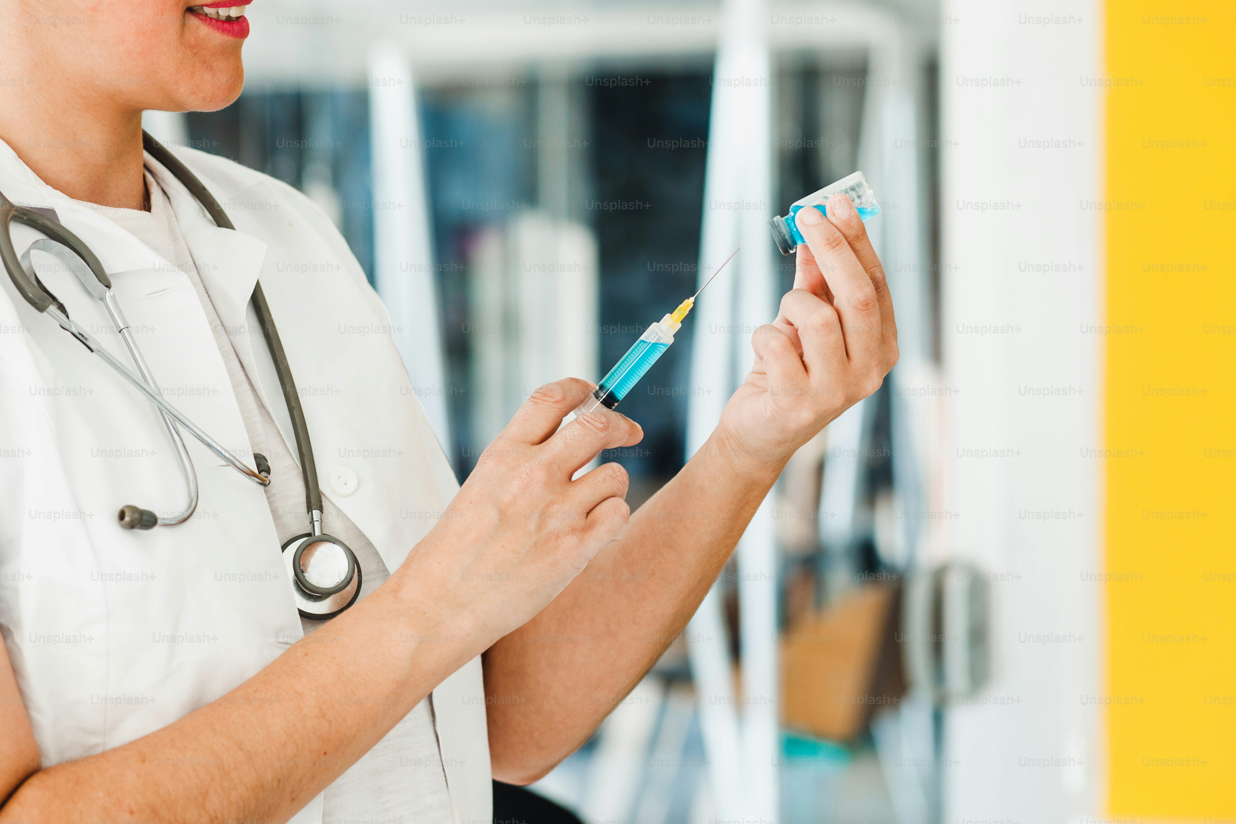 Latin Doctor filling syringe with medication, Vaccination and ...
