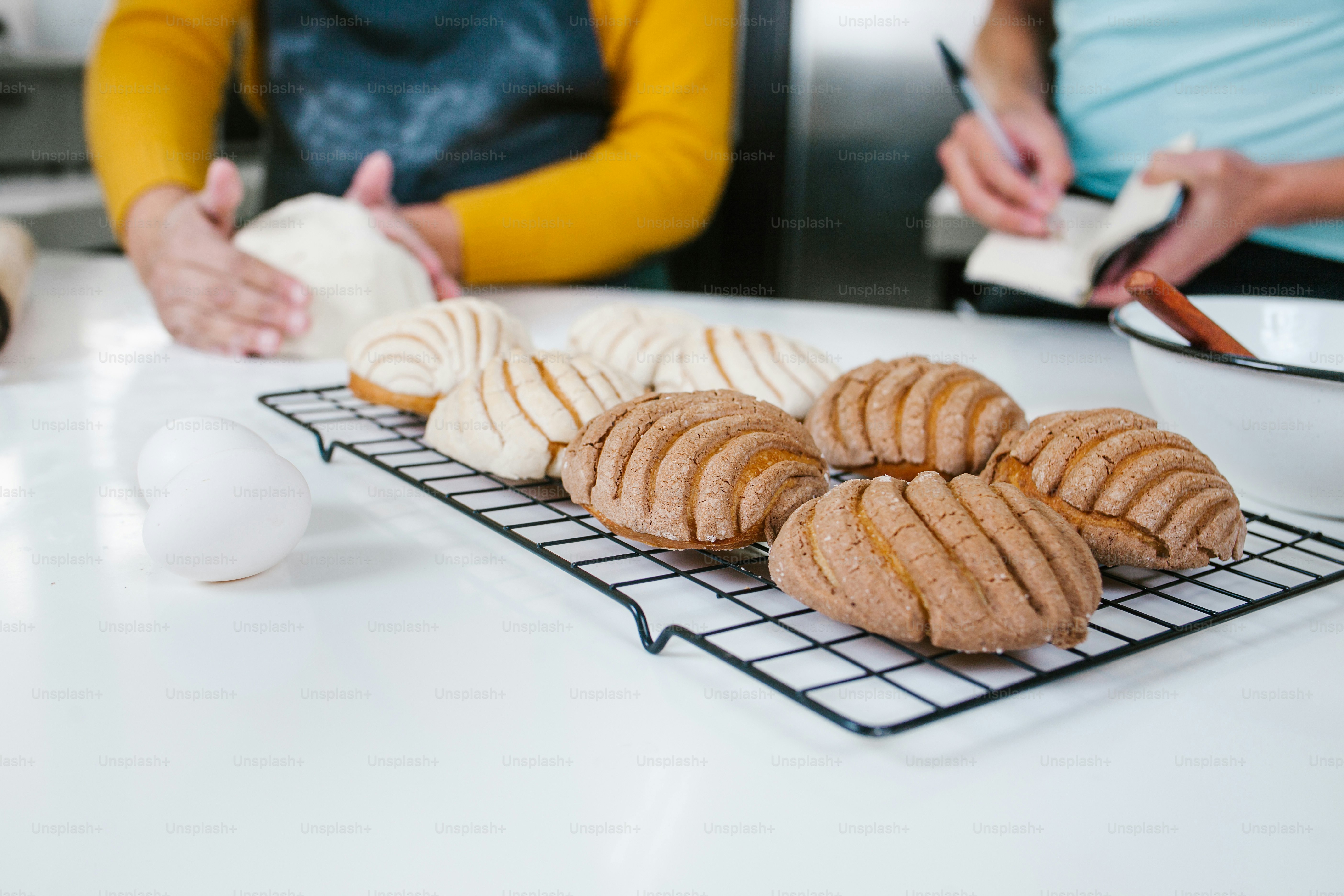 Hands of mexican bakers preparing dough for Conchas mexican traditional ...