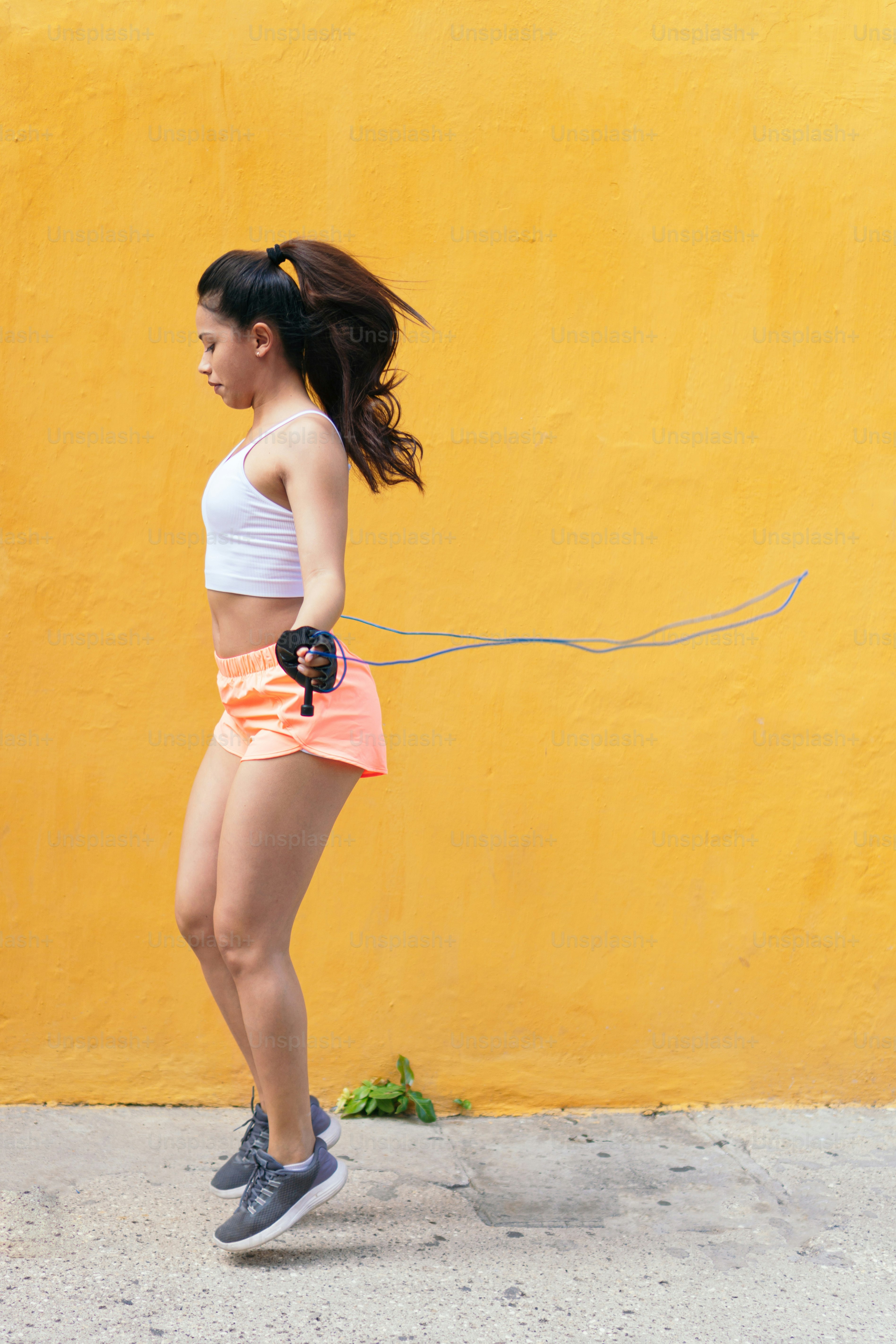 Woman in sportswear doing jump rope training photo – Exercising Image on Unsplash
