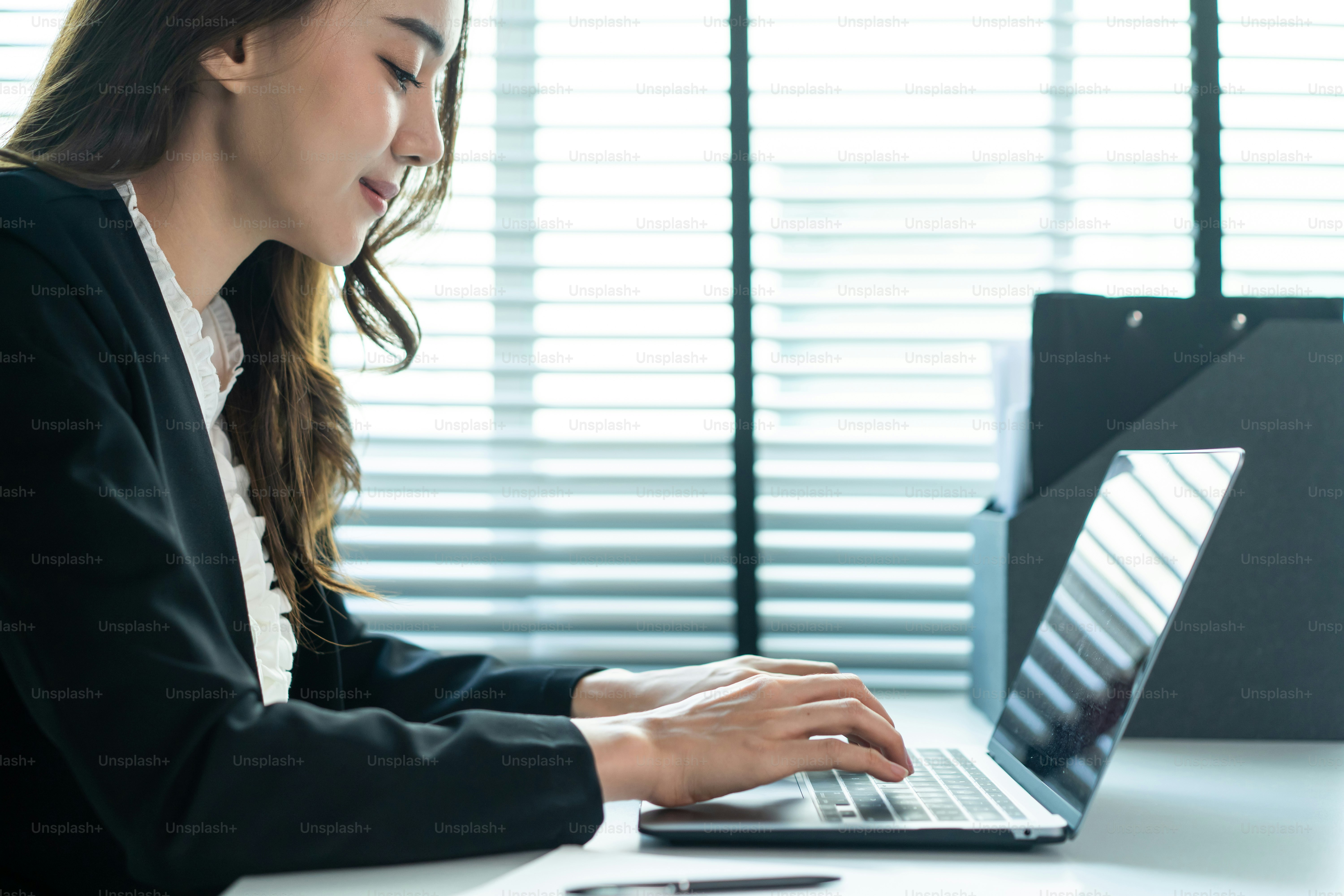 Close up of Asian business woman work in office, typing on keyboard ...