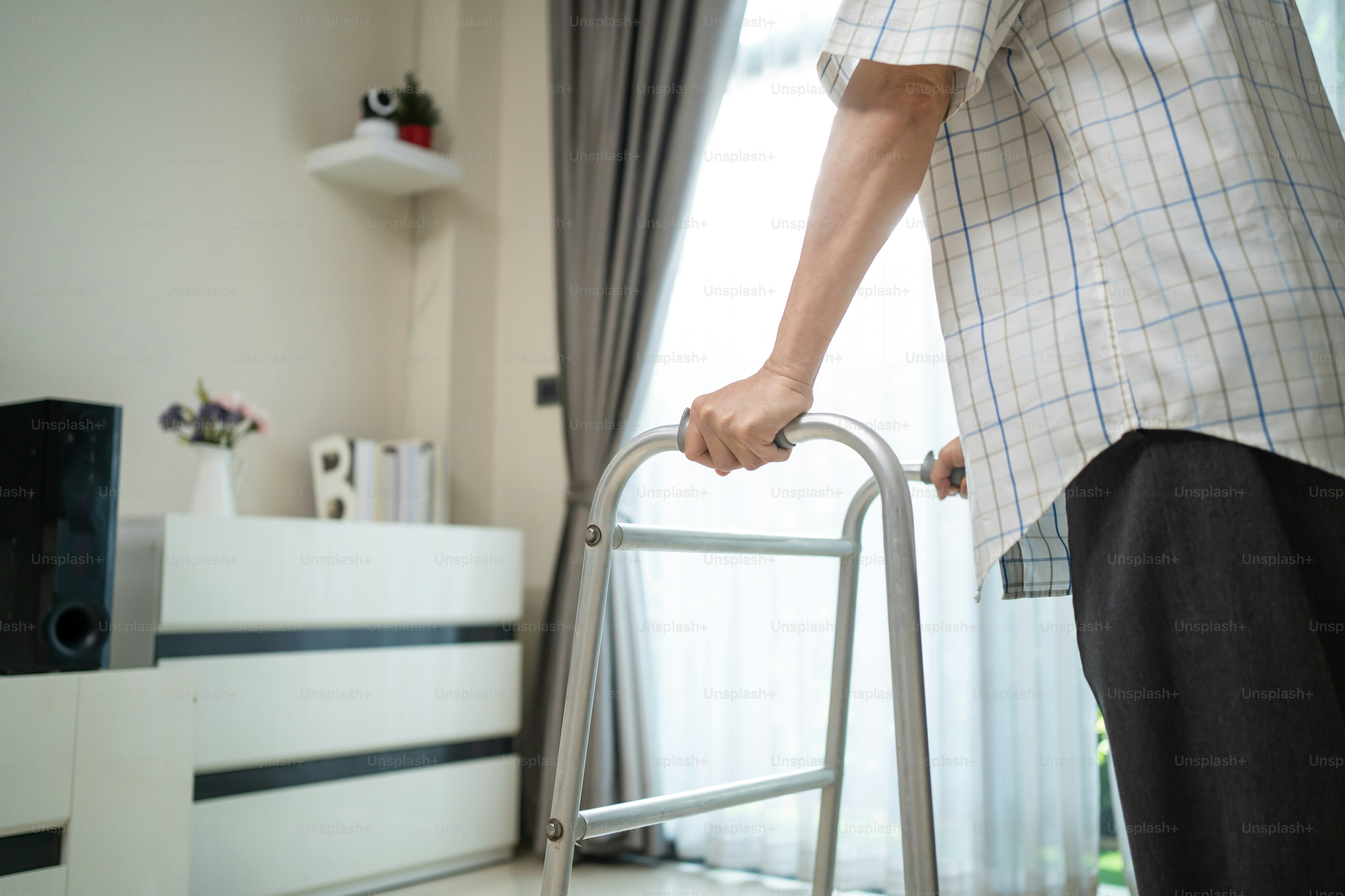 Close up hand of Senior disabled man walk with walker at nursing home ...