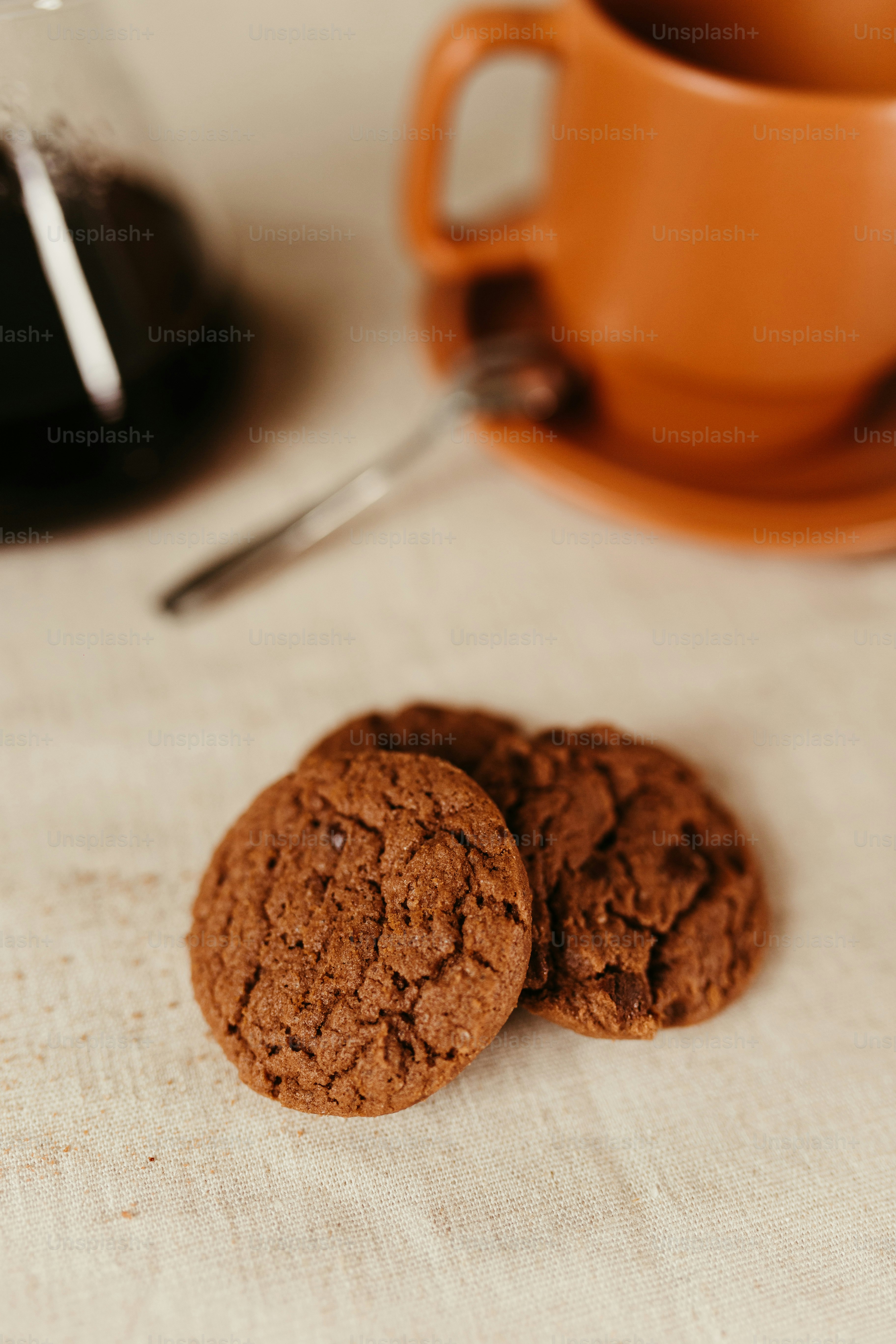 A couple of cookies sitting on top of a table photo – Cookies Image on ...