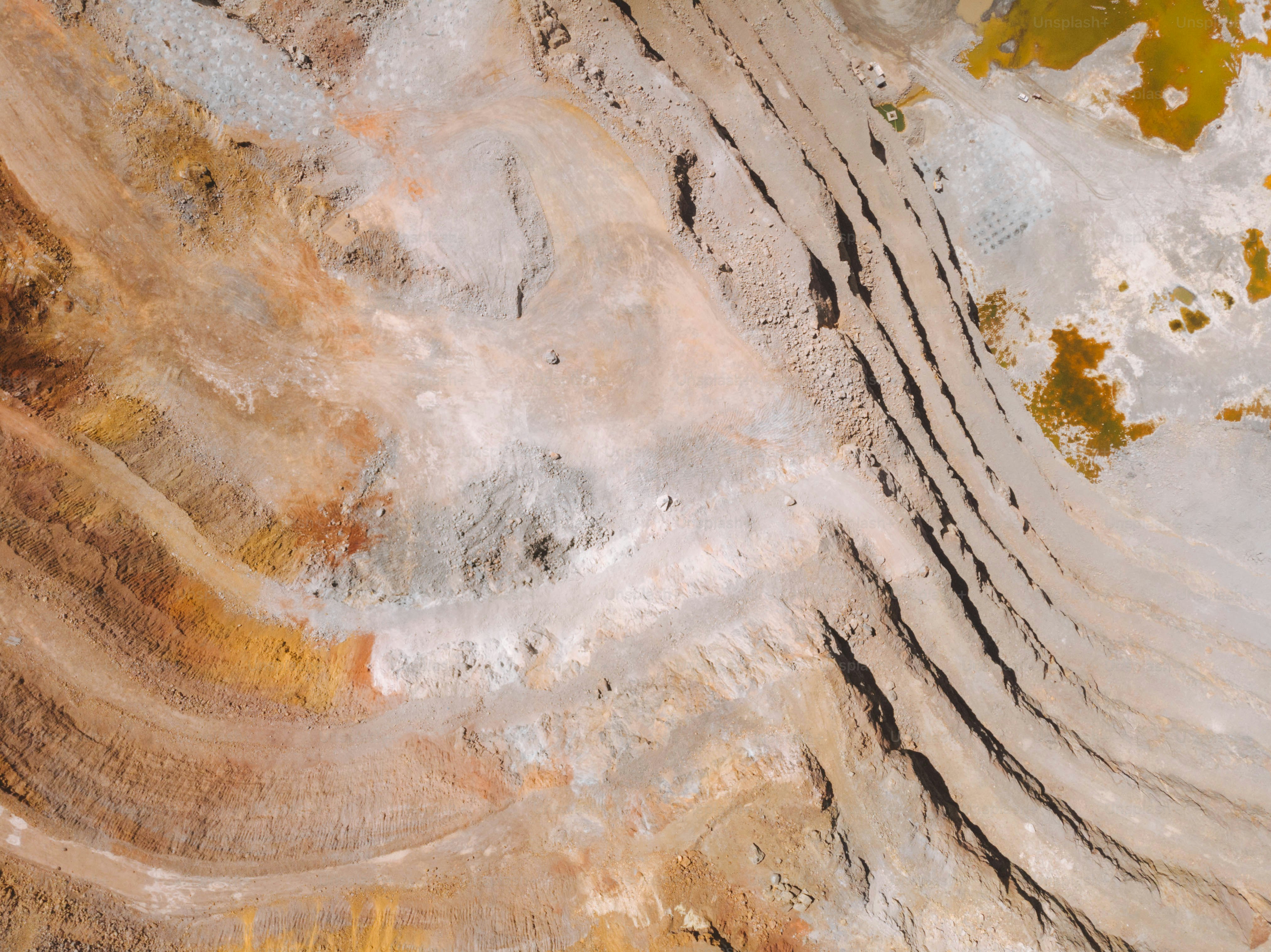 An aerial view of a dirt road and a hill photo – Mining Image on Unsplash