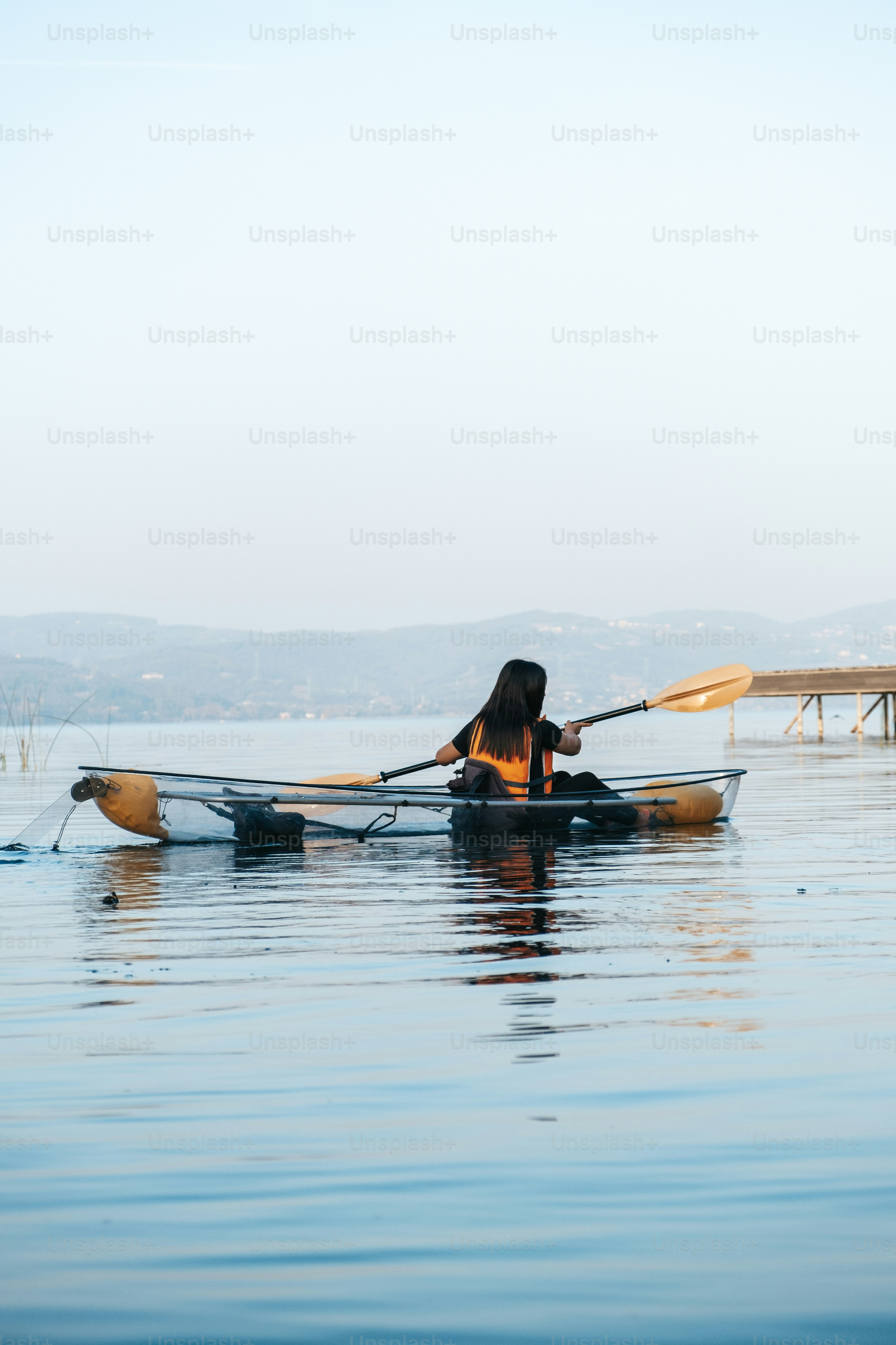 A person in a kayak paddling on the water photo – Canoe Image on Unsplash
