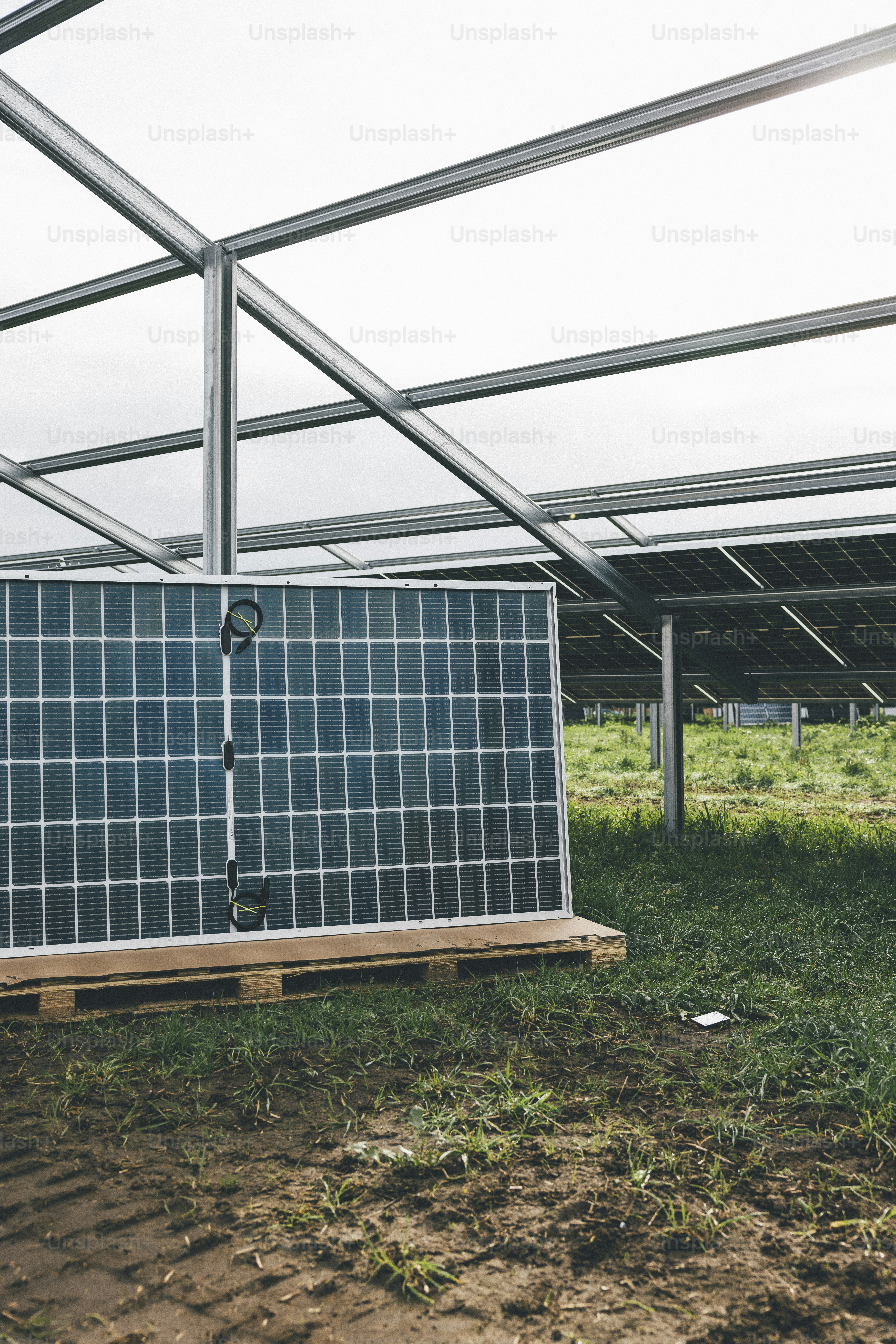 A solar panel sitting on top of a wooden pallet photo – Technology ...