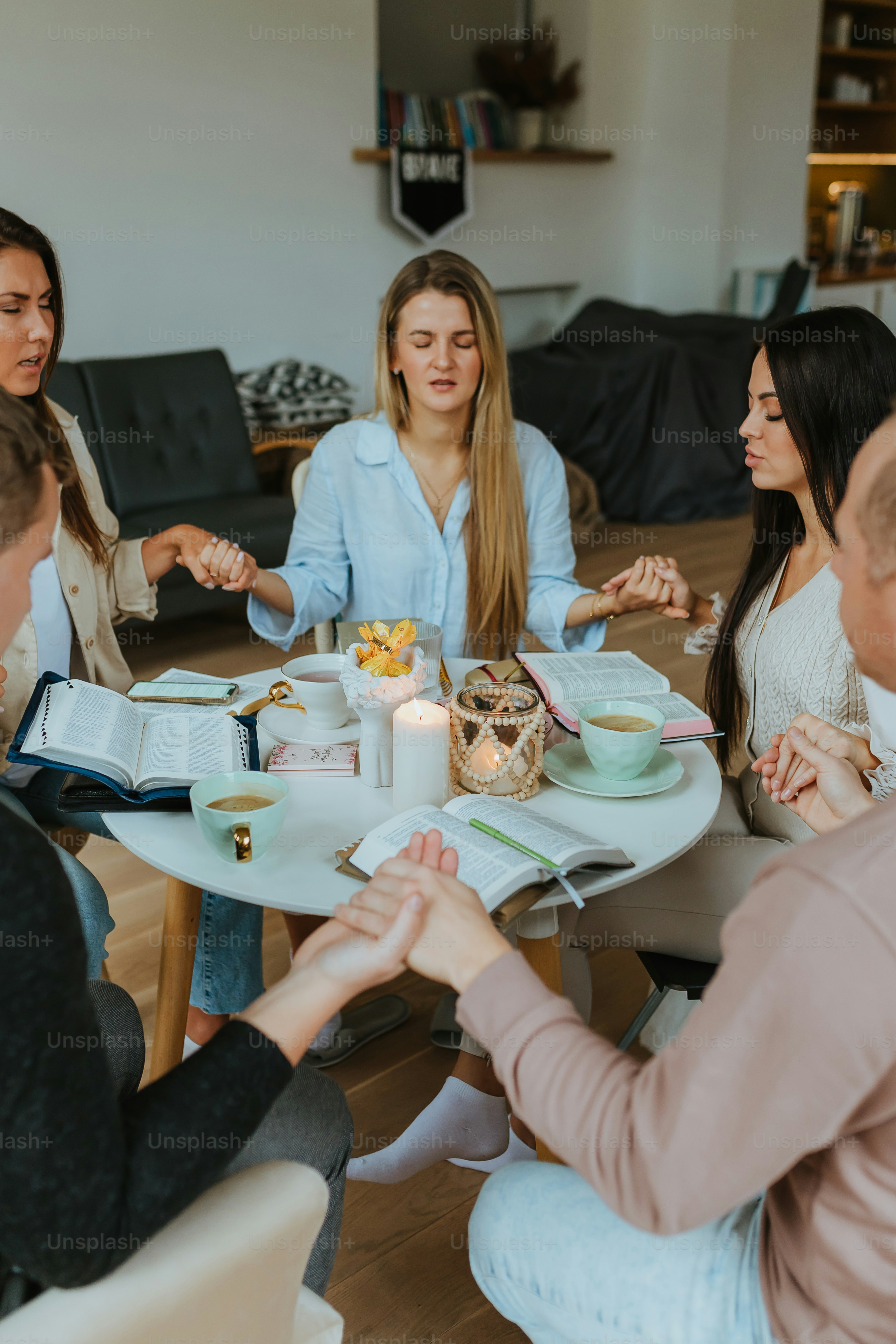 A group of women sitting around a table with food on it photo ...