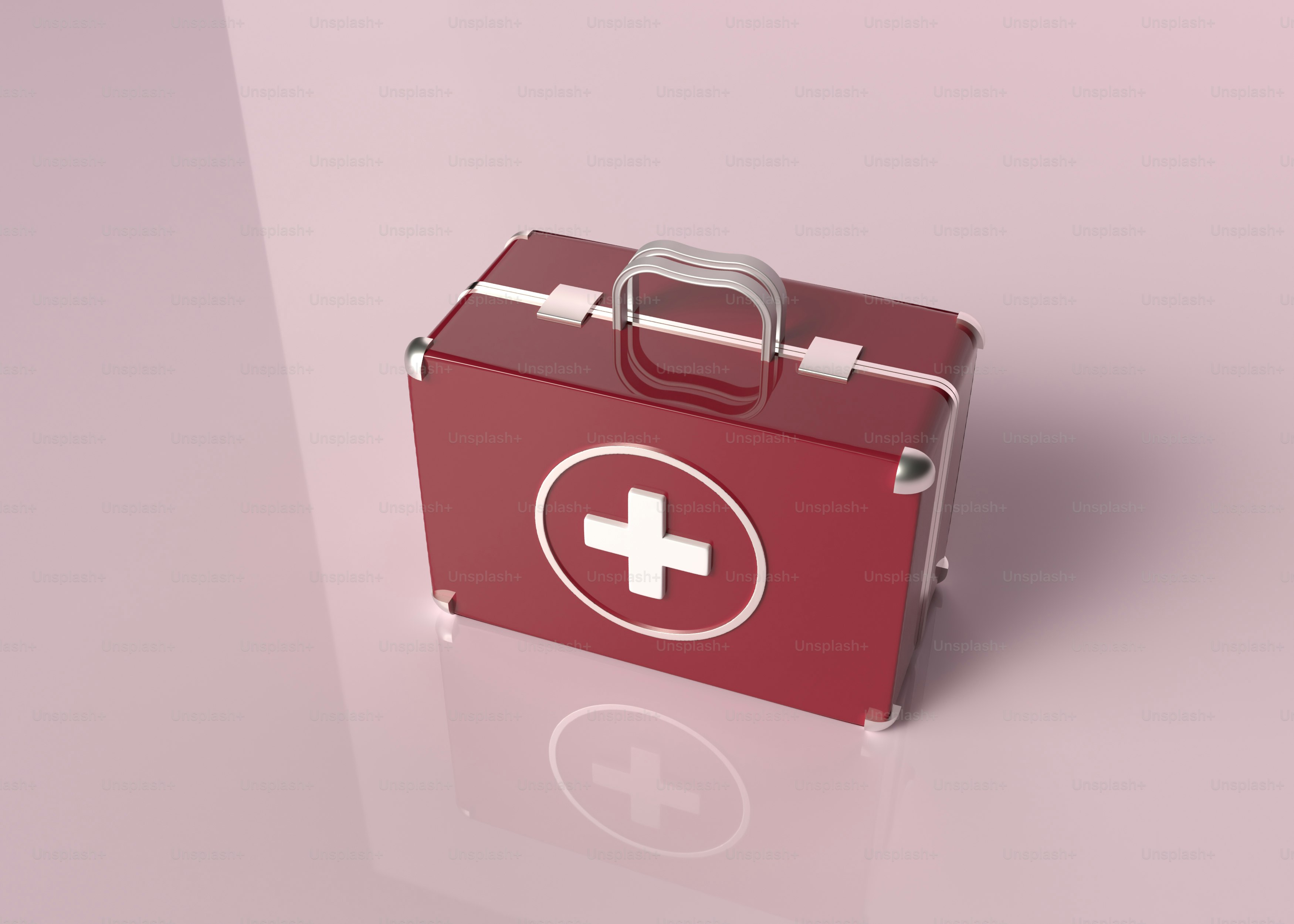A red first aid kit sitting on top of a table photo – Safety Image on ...