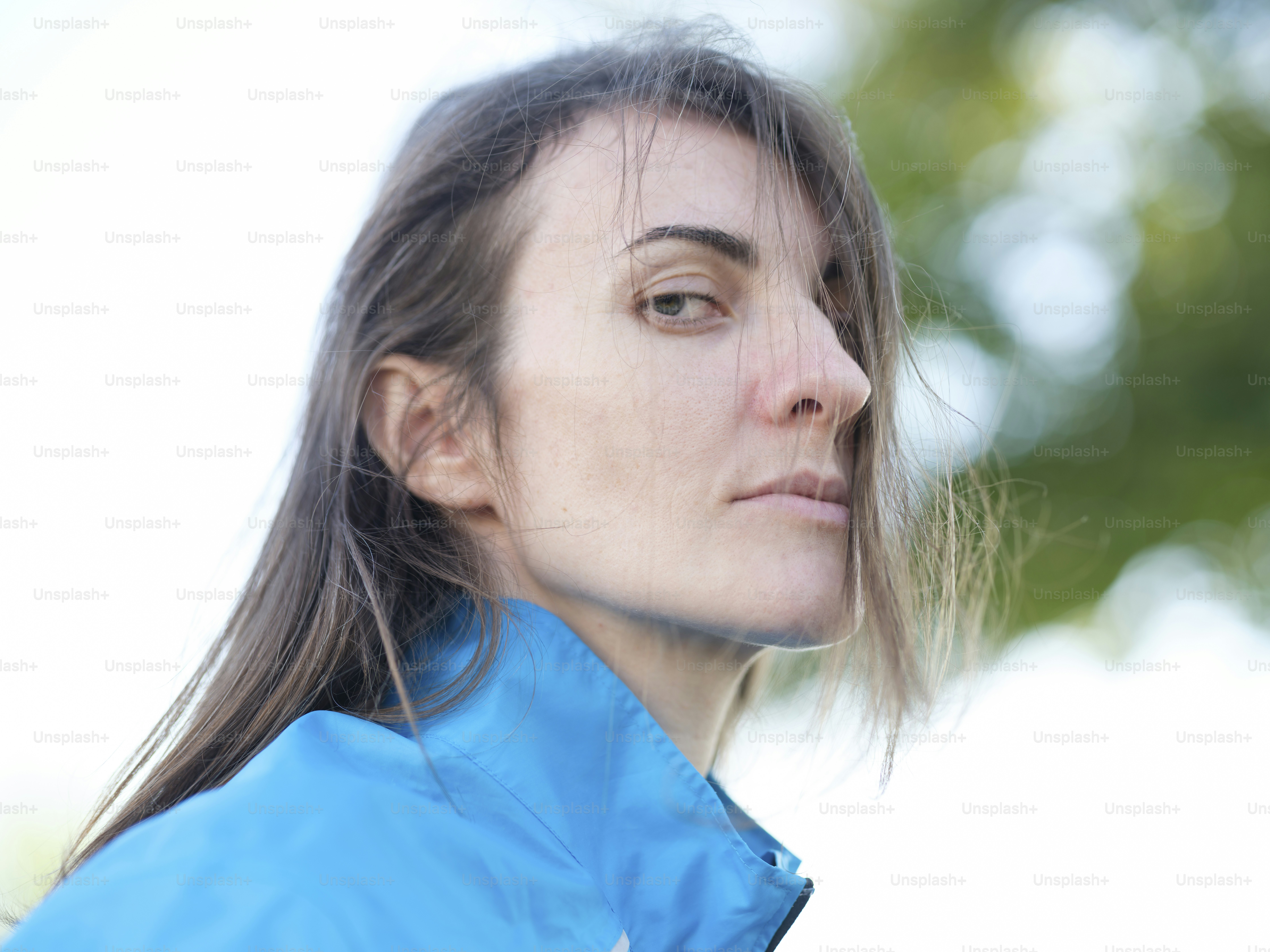 A close up of a person wearing a blue jacket photo – Sensitive Image on ...