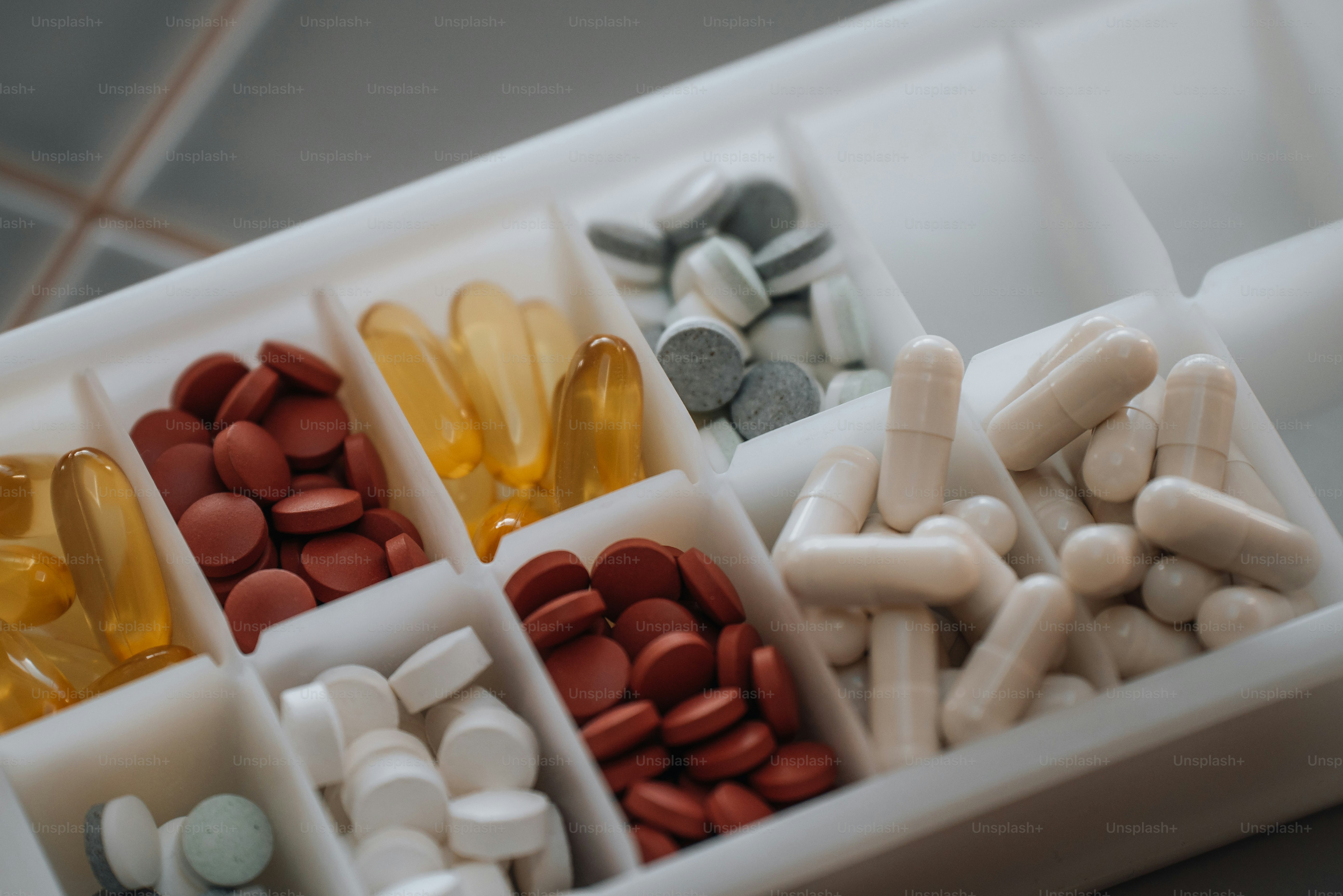 A pill box filled with lots of pills photo – Pills Image on Unsplash