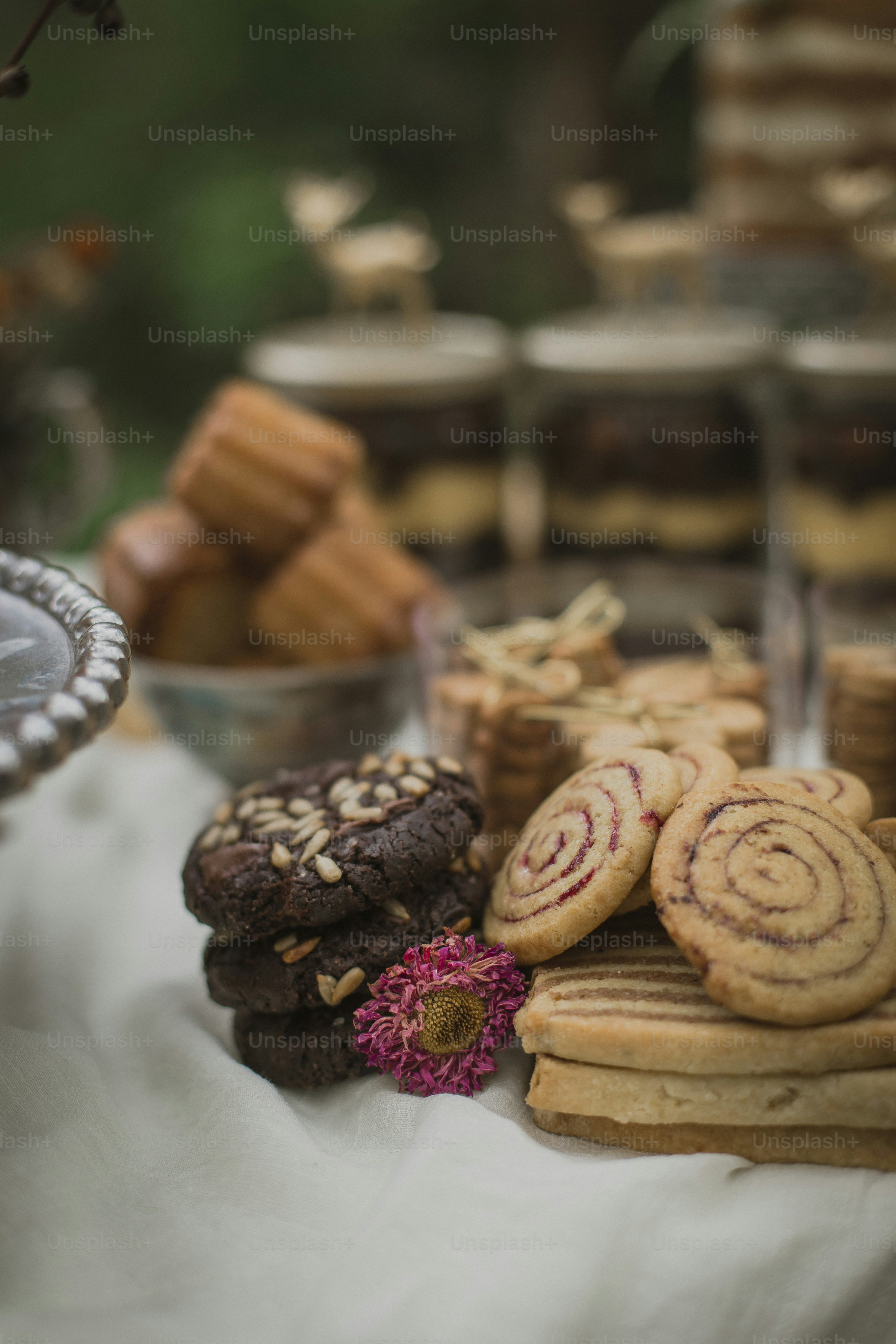 A table topped with lots of cookies and pastries photo – Pastries Image ...