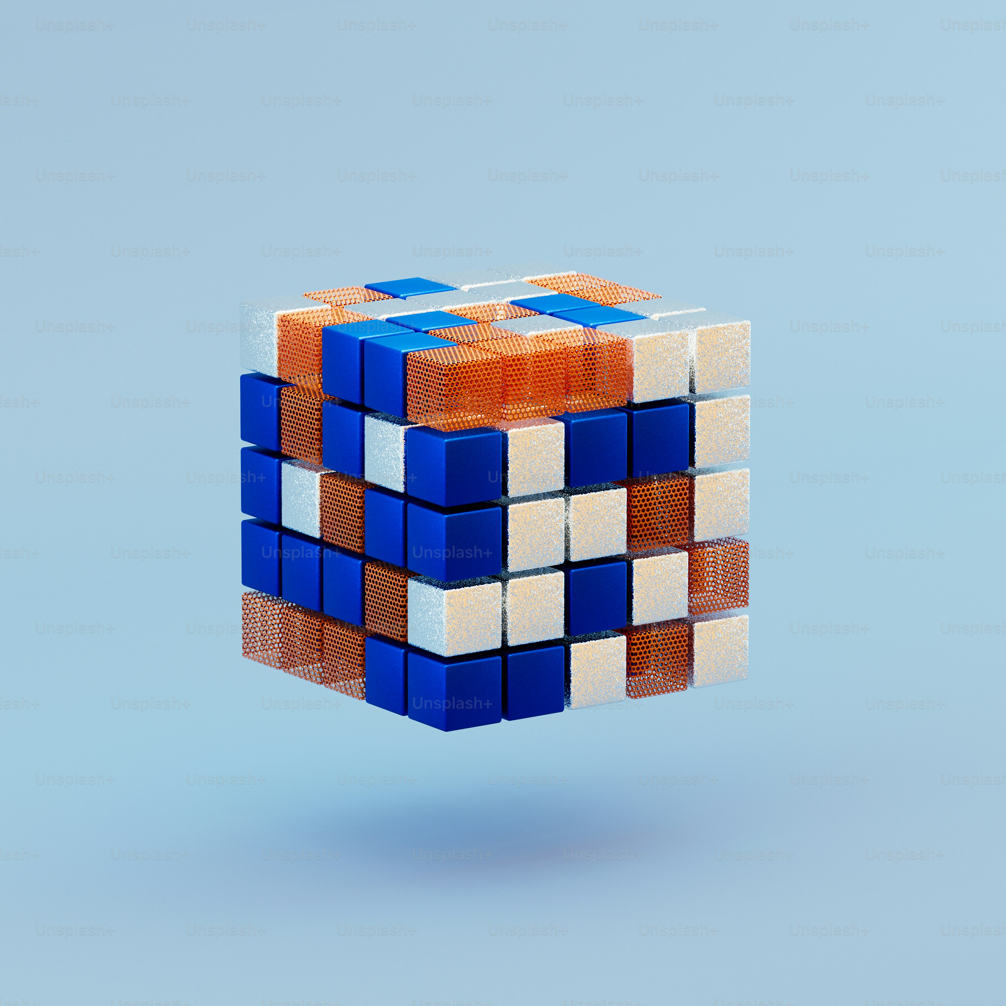 A rubik cube is shown on a blue background photo – Wallpaper Image on ...