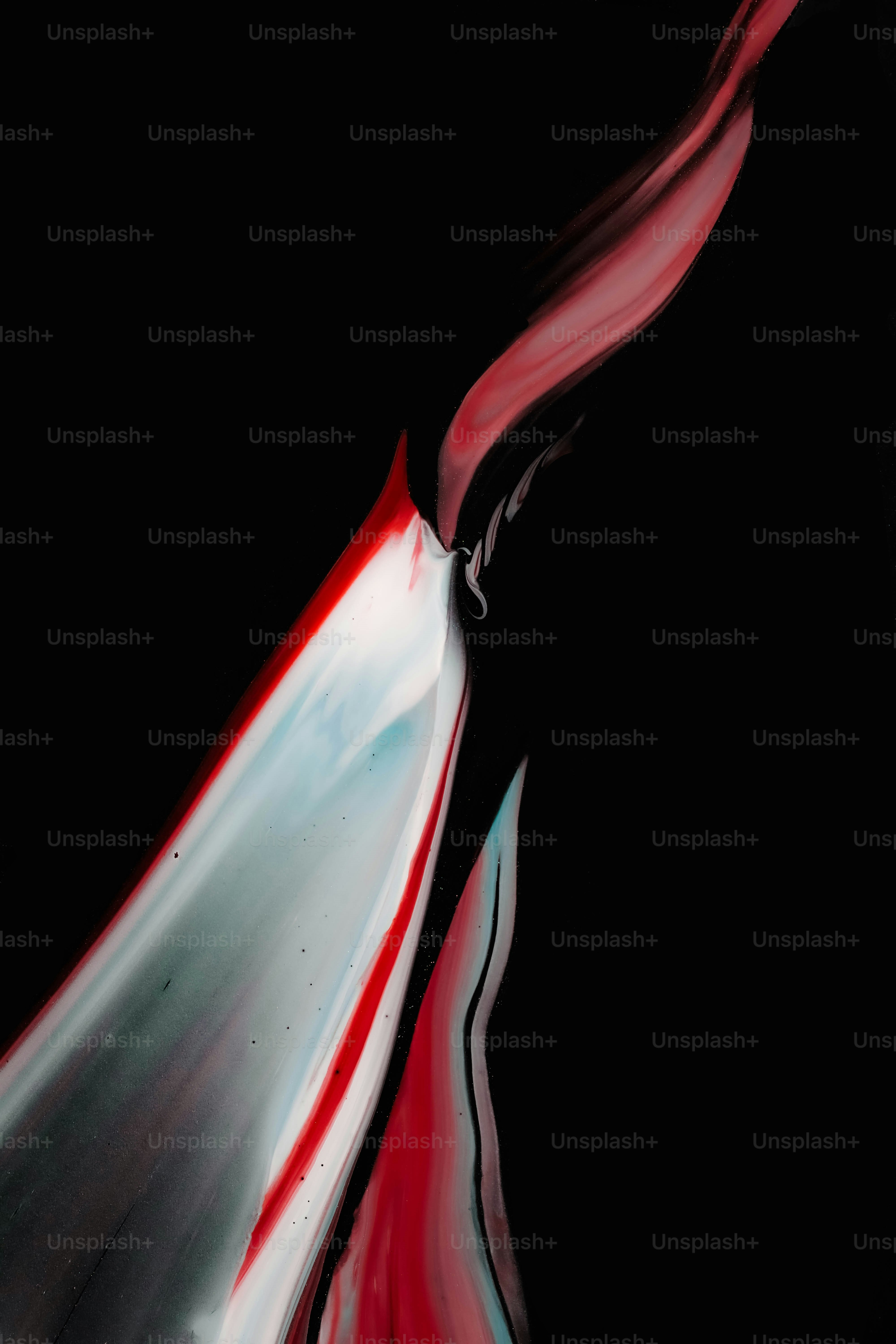 A black and red abstract painting on a black background photo ...
