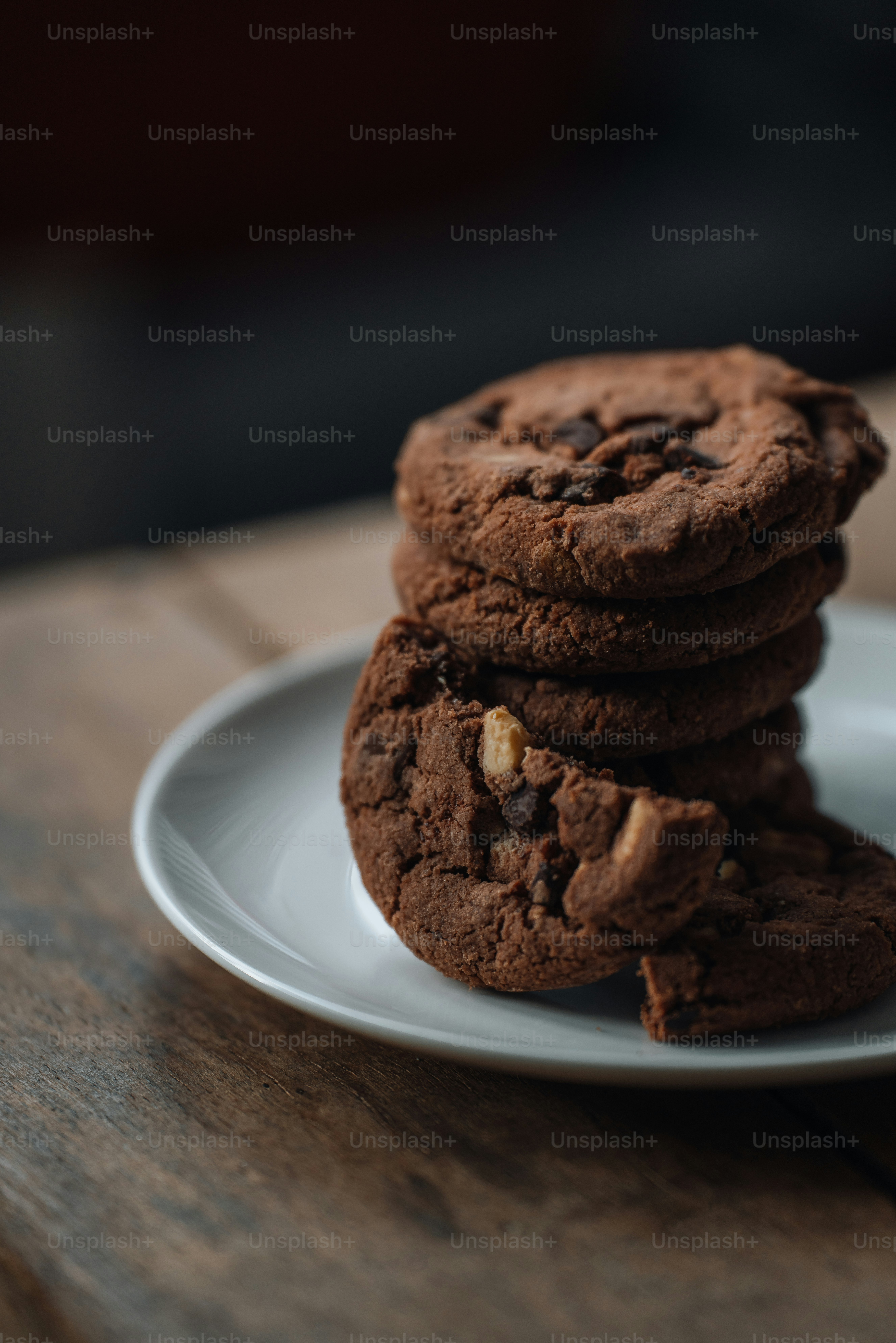 A stack of cookies sitting on top of a white plate photo – Food and ...