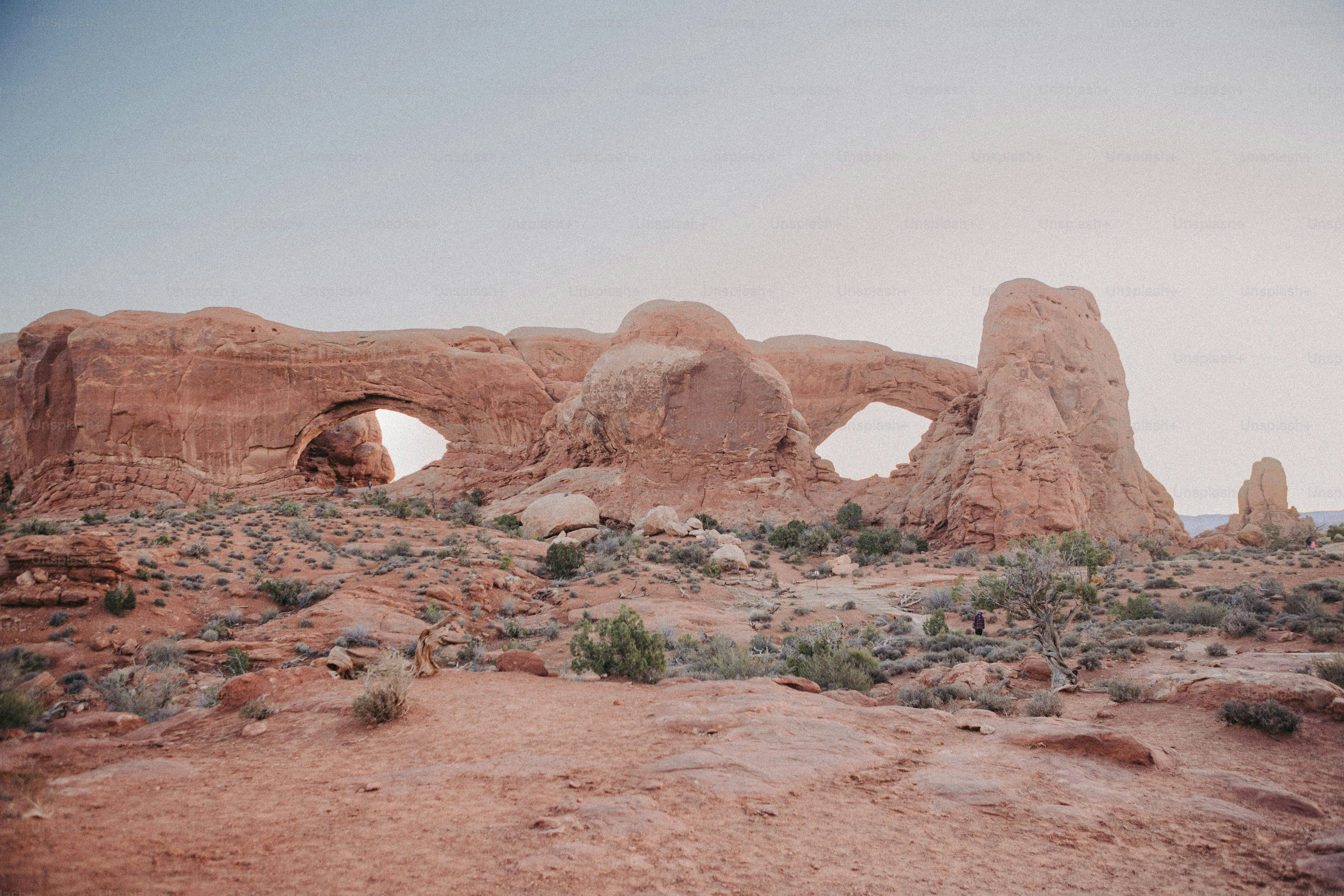 A rock formation with a hole in the middle of it photo – Drought Image ...