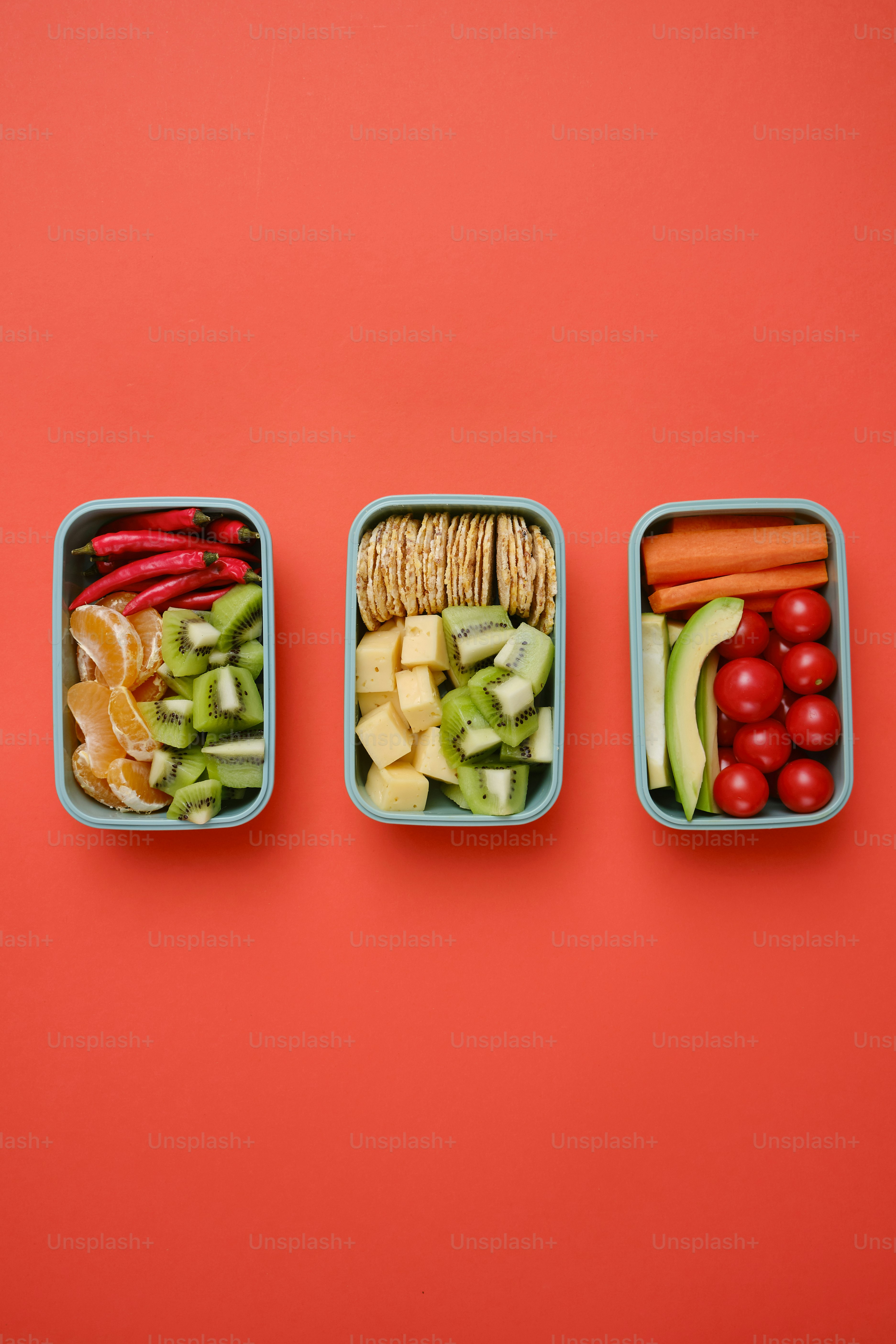 Three bento boxes filled with different types of food photo – Food and ...