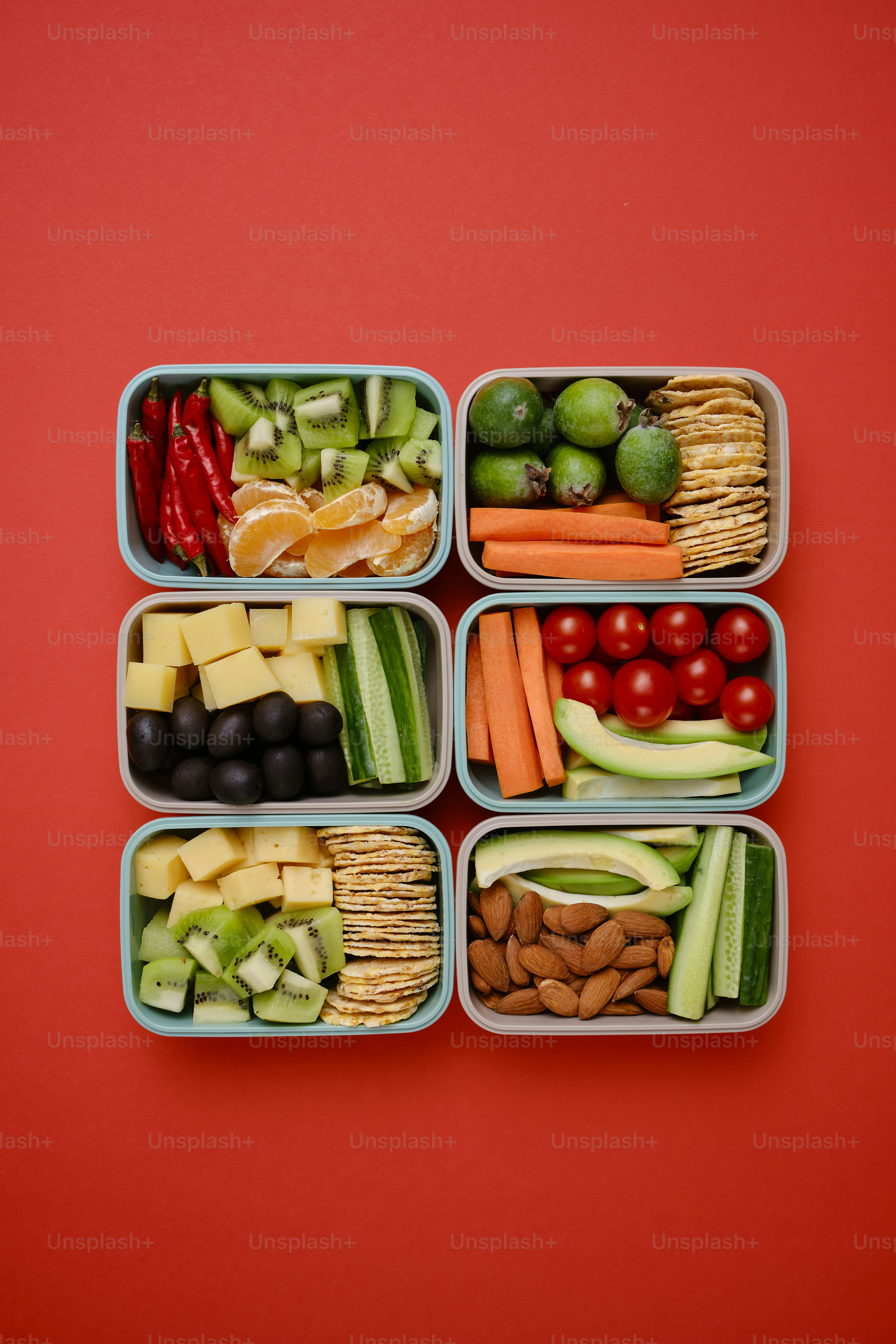 A group of four containers filled with different types of food photo ...