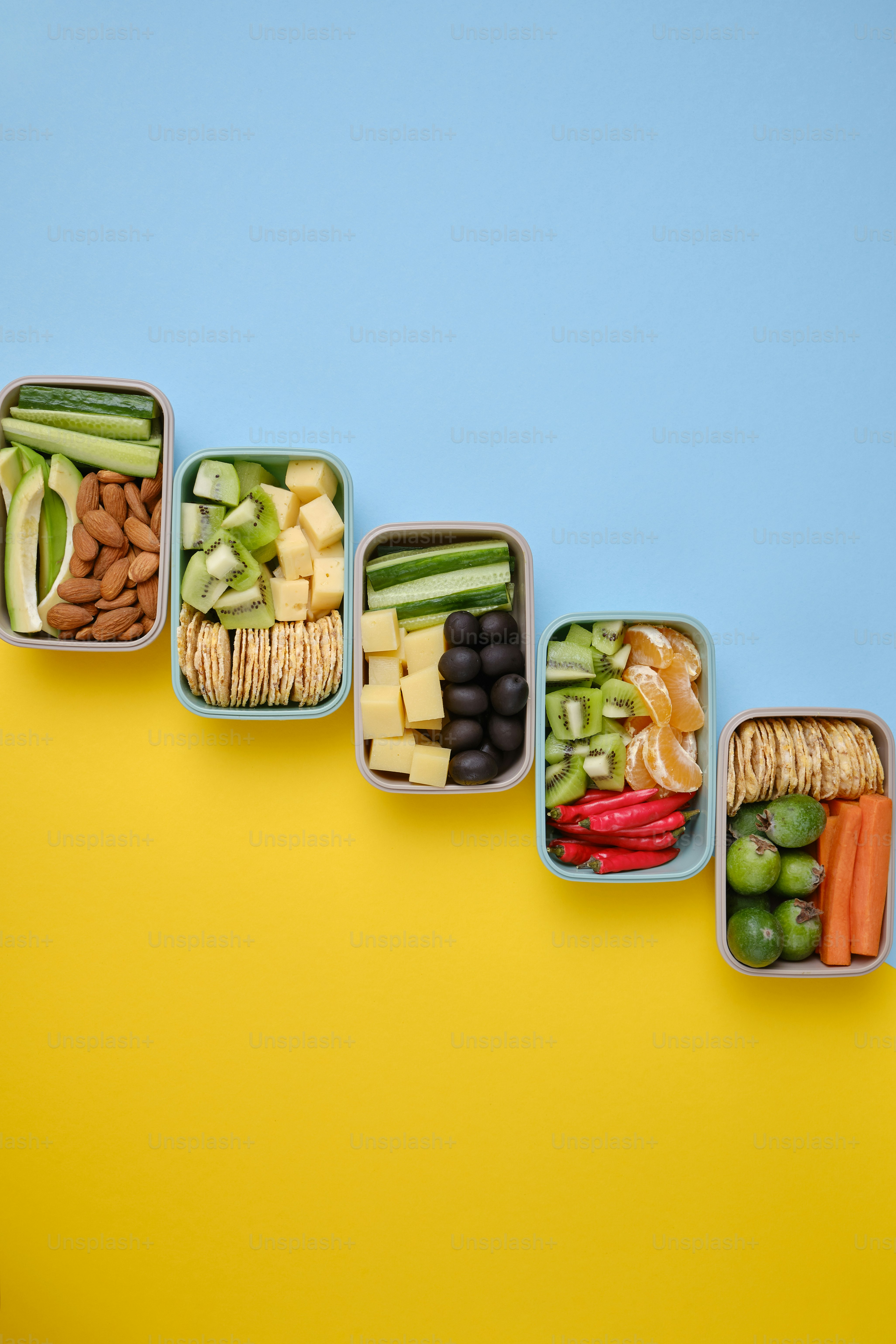 A row of small containers filled with different types of food photo ...