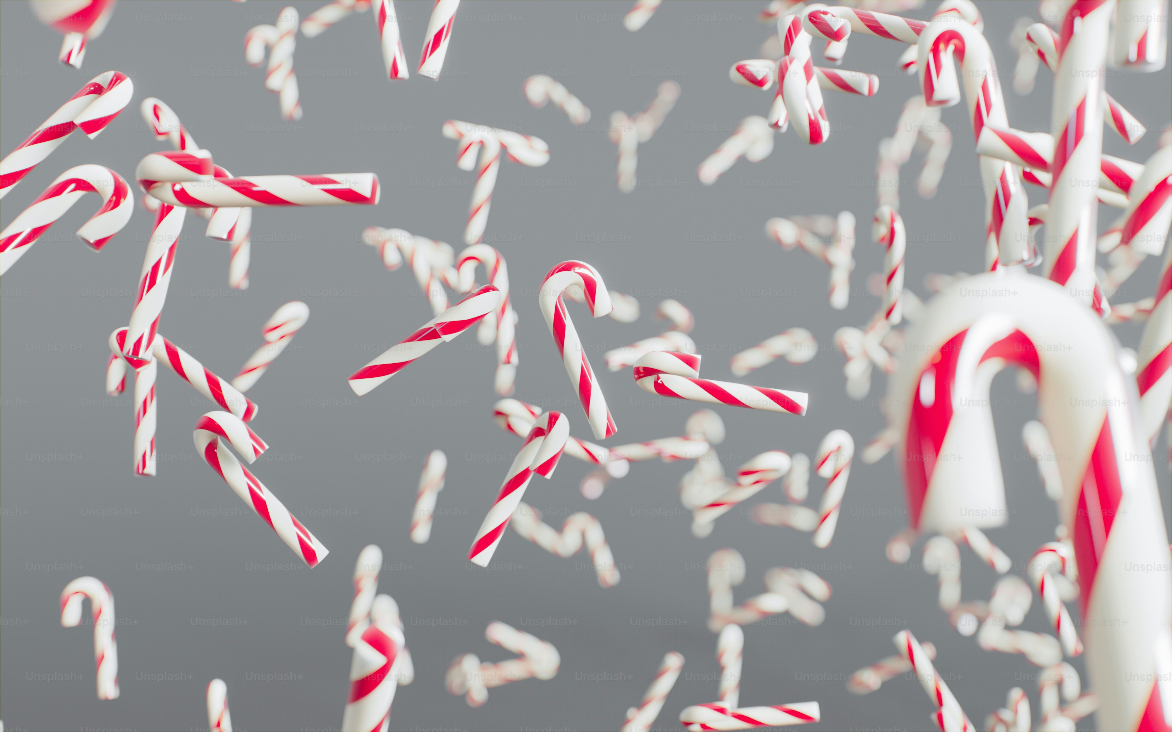 A group of candy canes flying through the air photo – Supplements Image ...