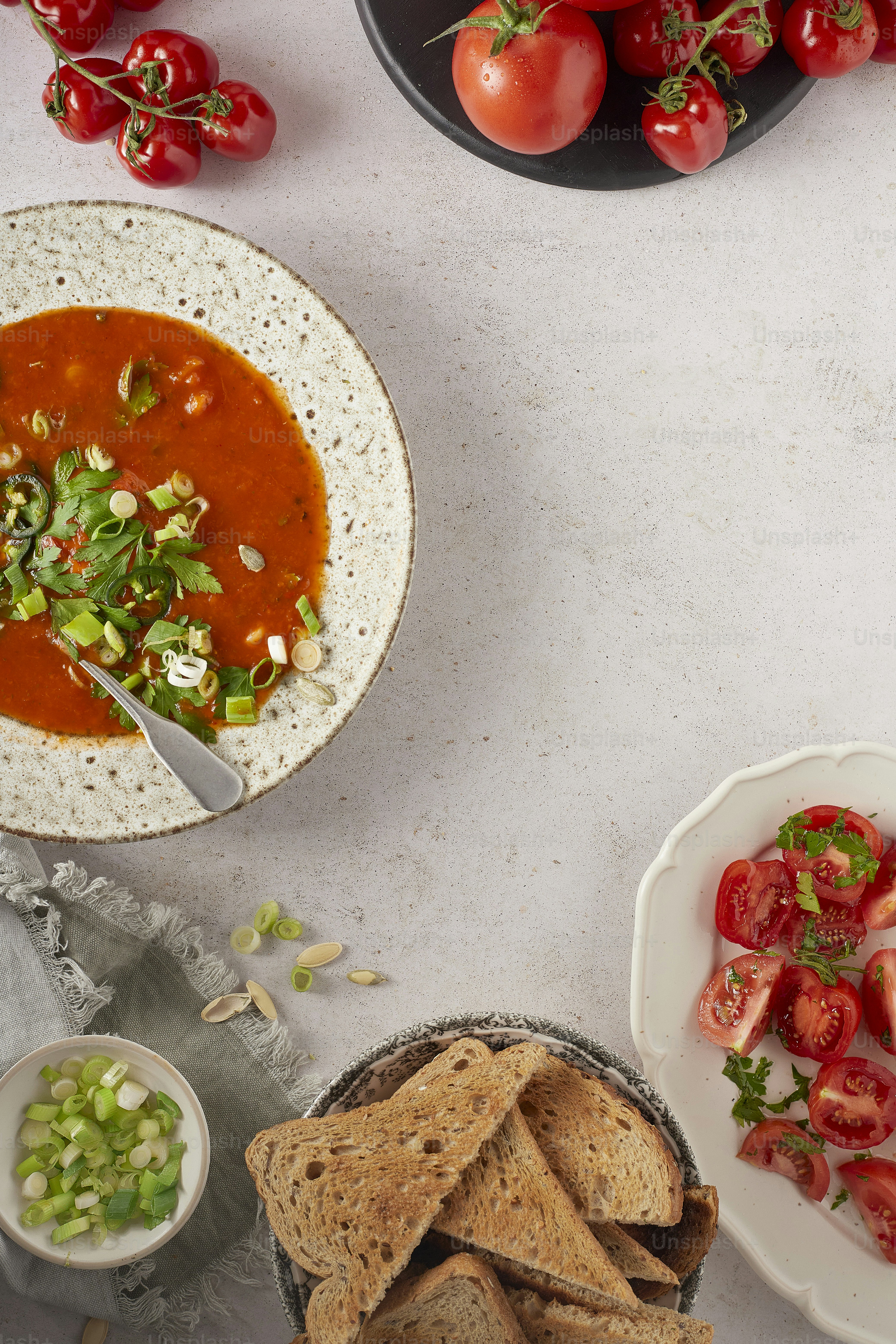 A table topped with bowls of soup and bread photo – Healthy eating ...
