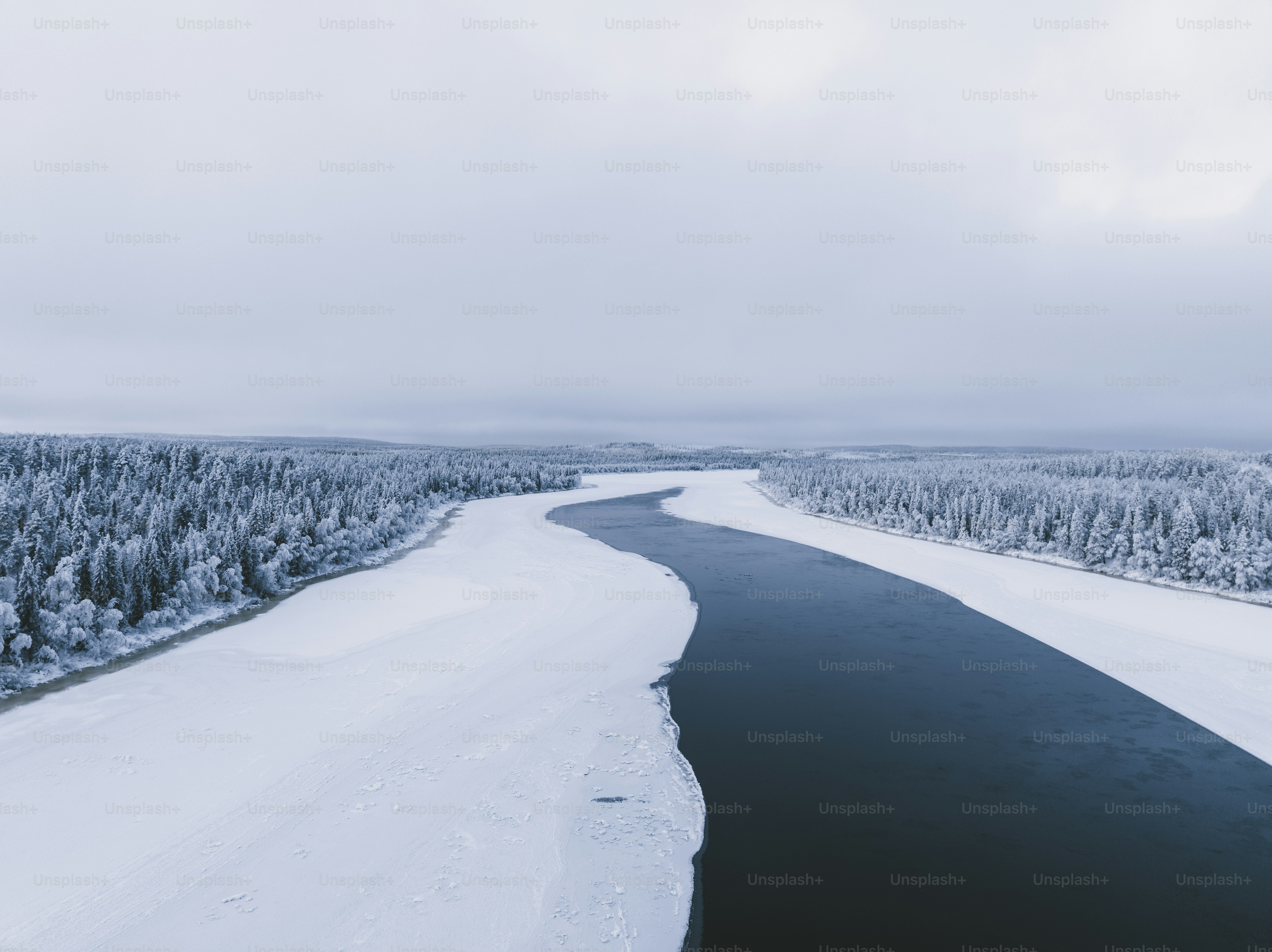 An aerial view of a snow covered area photo – Land and sky Image on ...