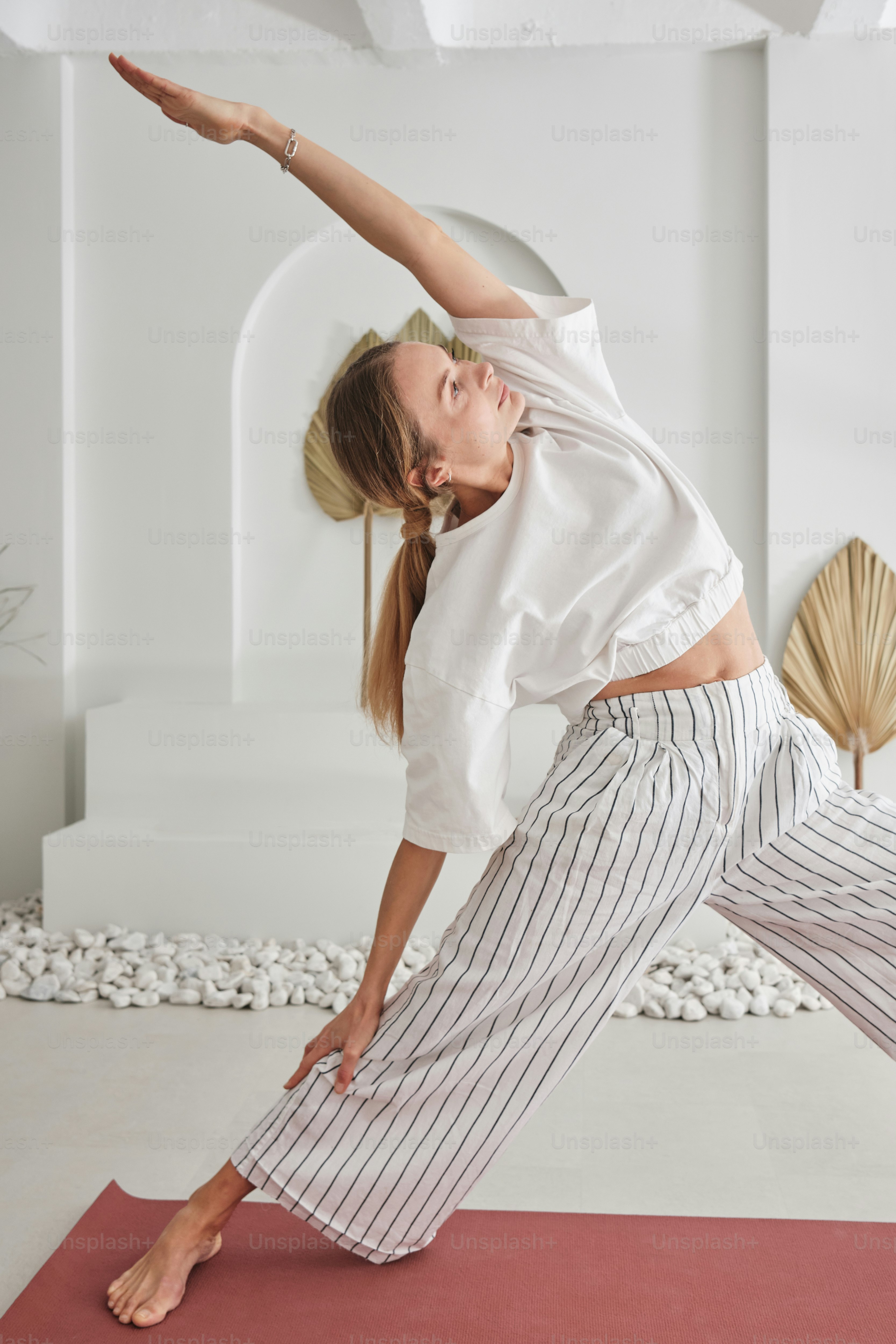 A person dancing on a red carpet photo – Woman Image on Unsplash