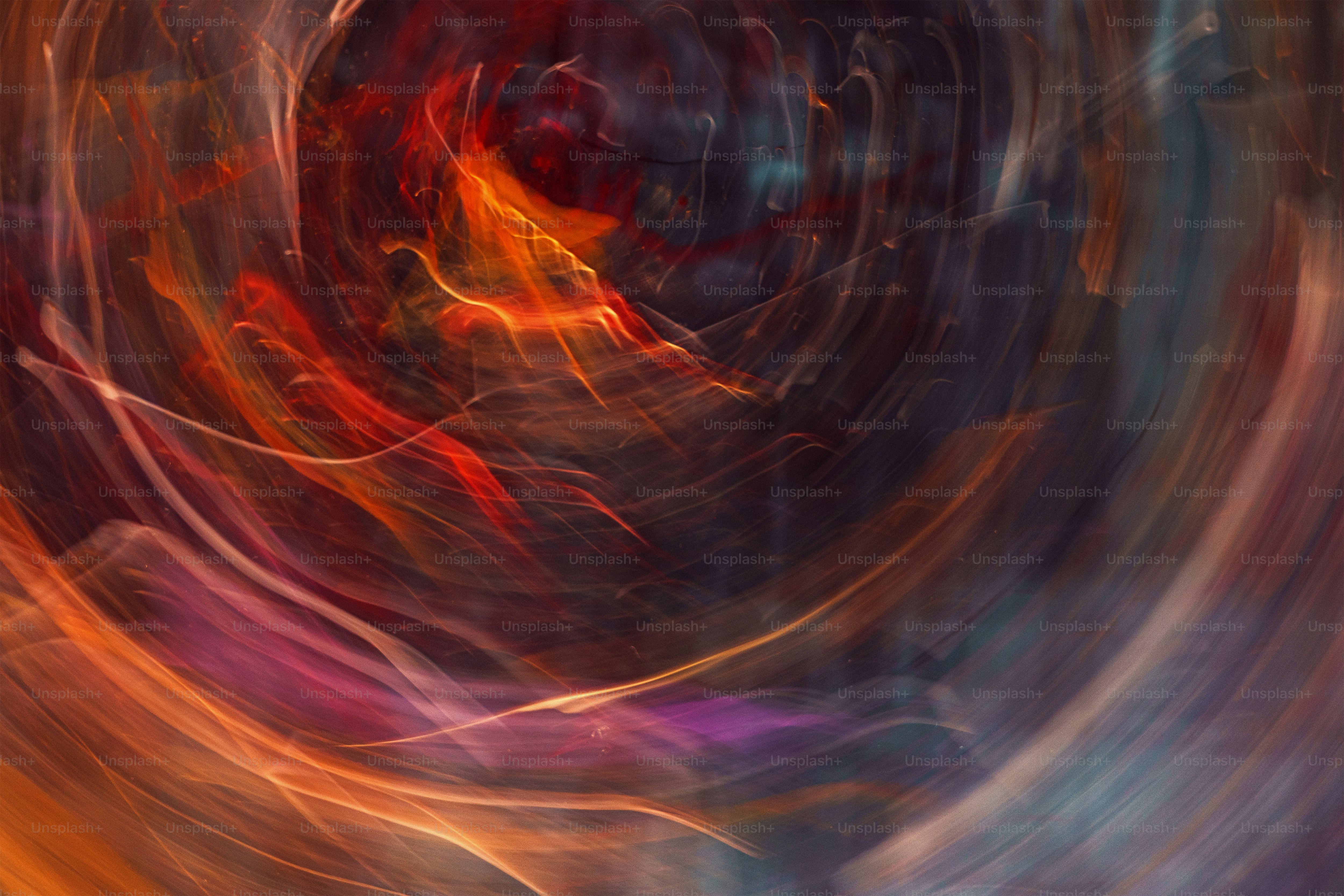 A close-up of a colorful swirl of light photo – Surrealism Image on ...