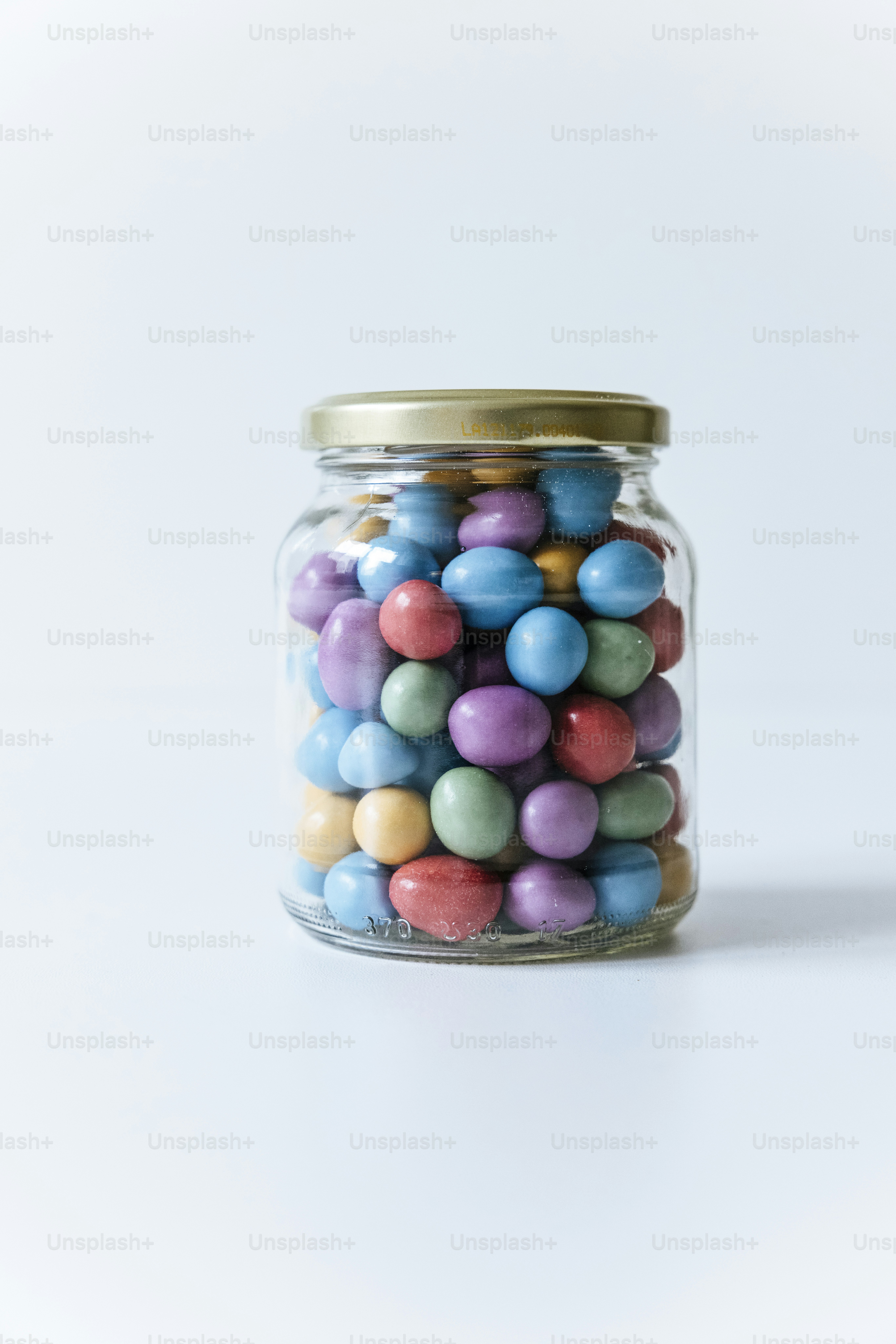A group of glass jars with candy in them photo – Candy Image on Unsplash