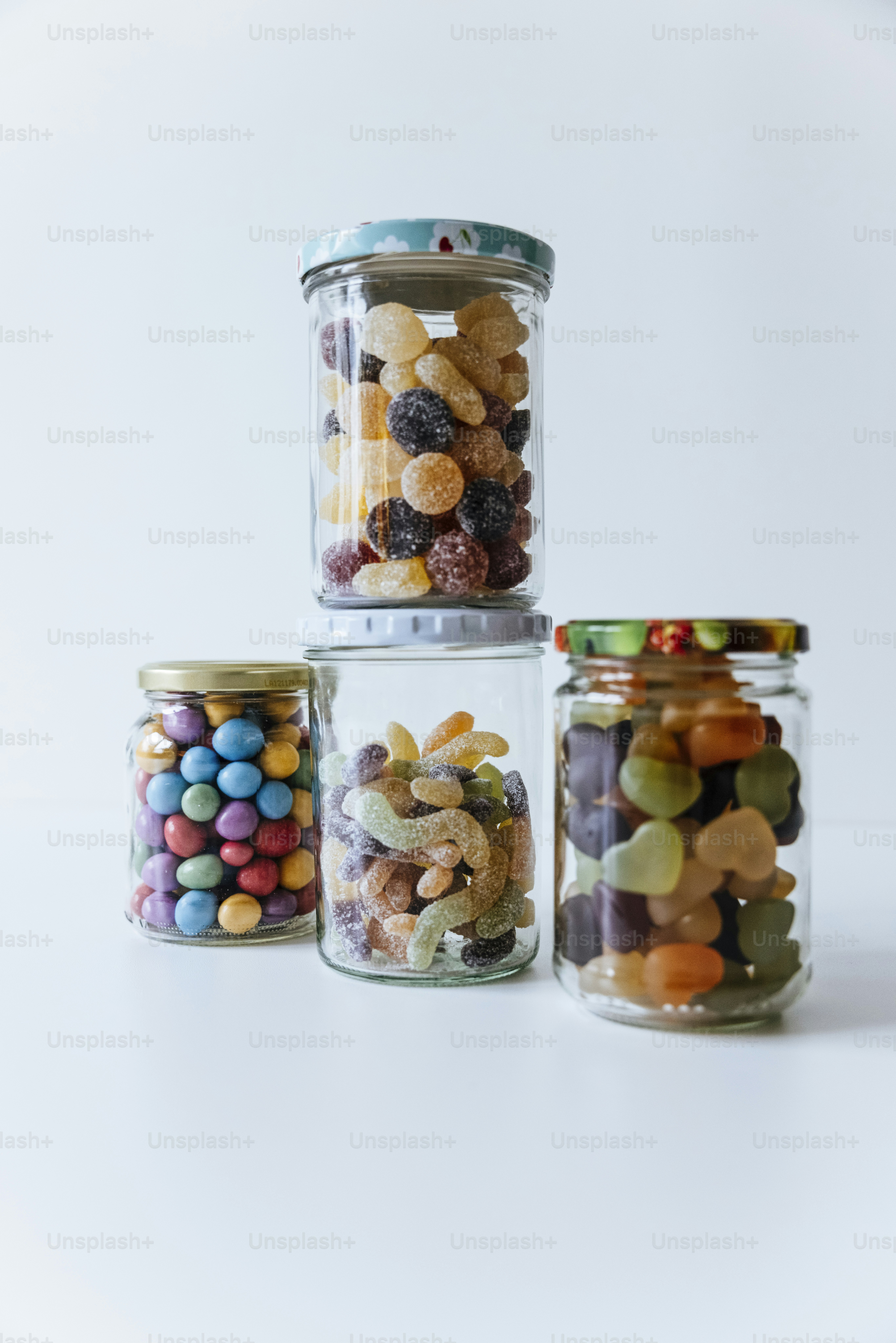 A group of glass jars with candy in them photo – Candy Image on Unsplash