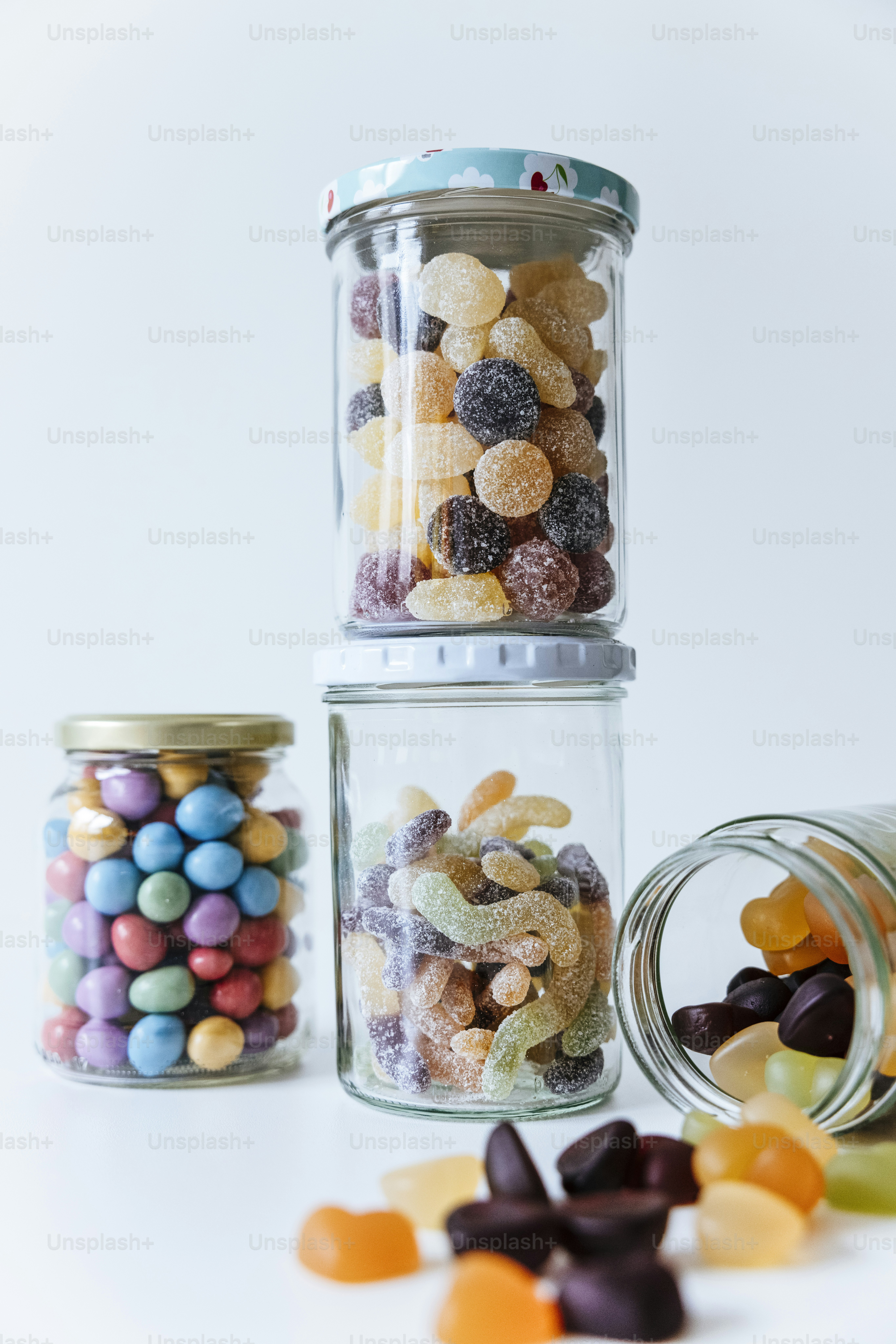 A group of glass jars with candy in them photo – Candy Image on Unsplash