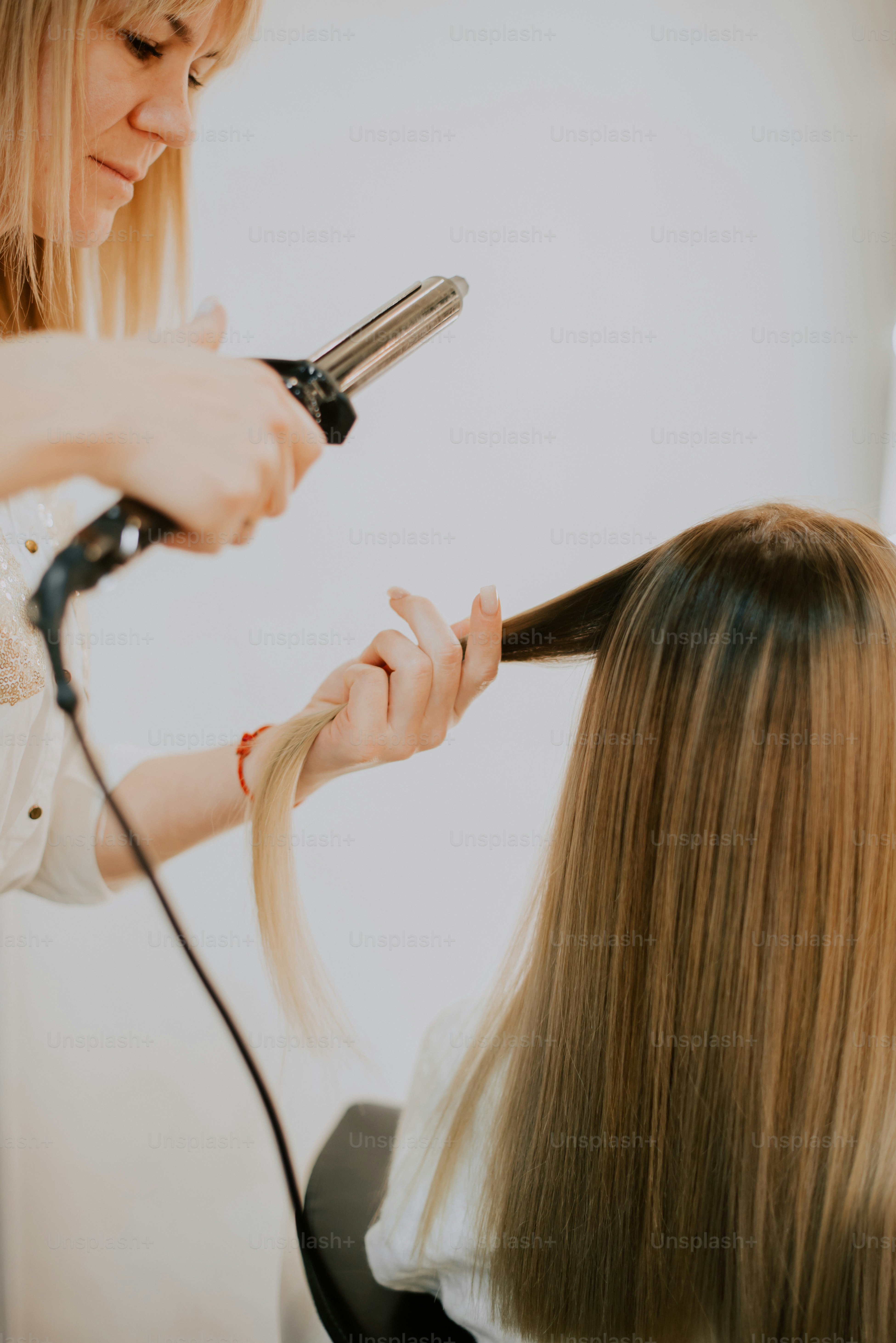A woman getting her hair done photo – Hairdresser Image on Unsplash