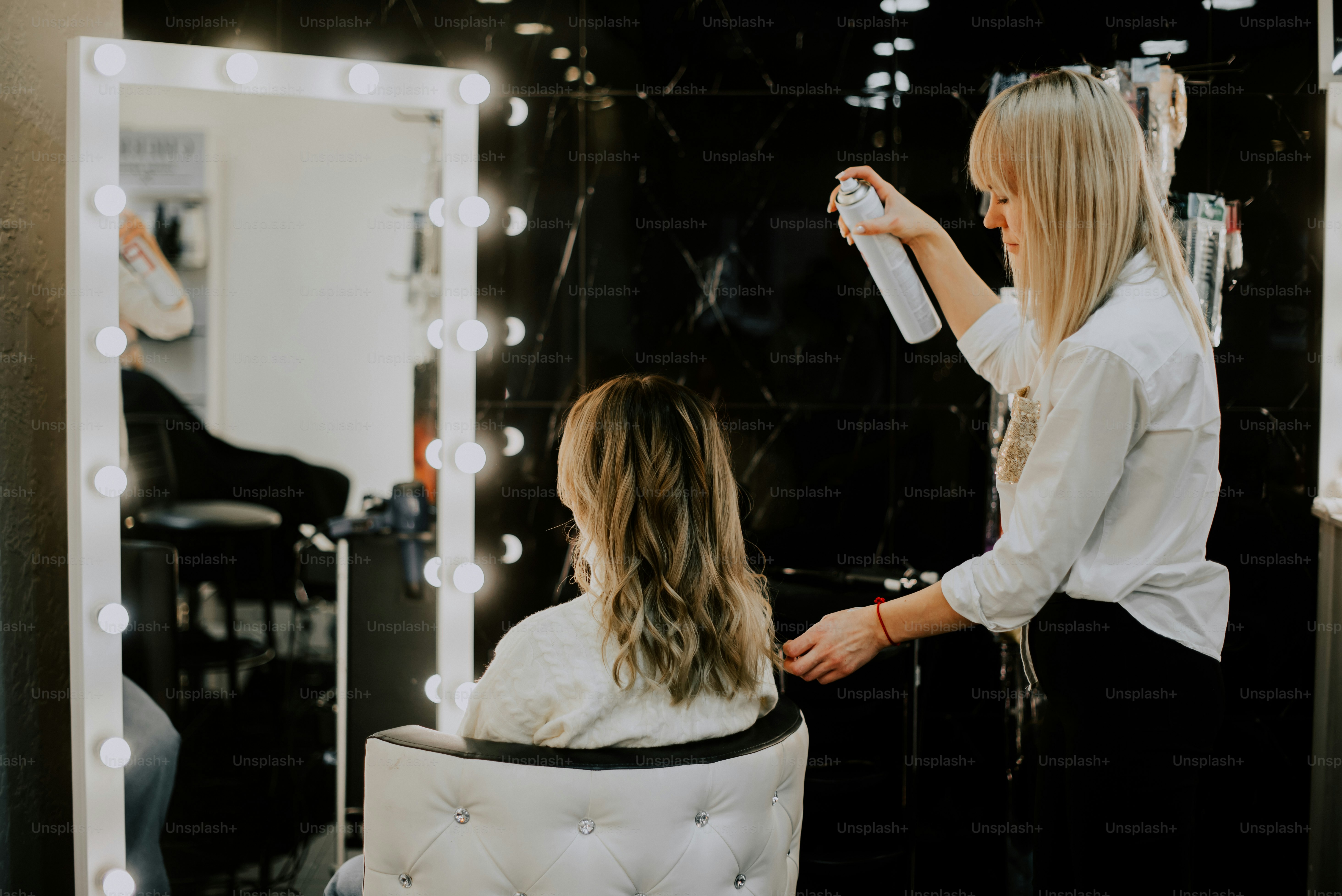A woman getting her hair cut by a hair stylist photo – Hair Image on ...