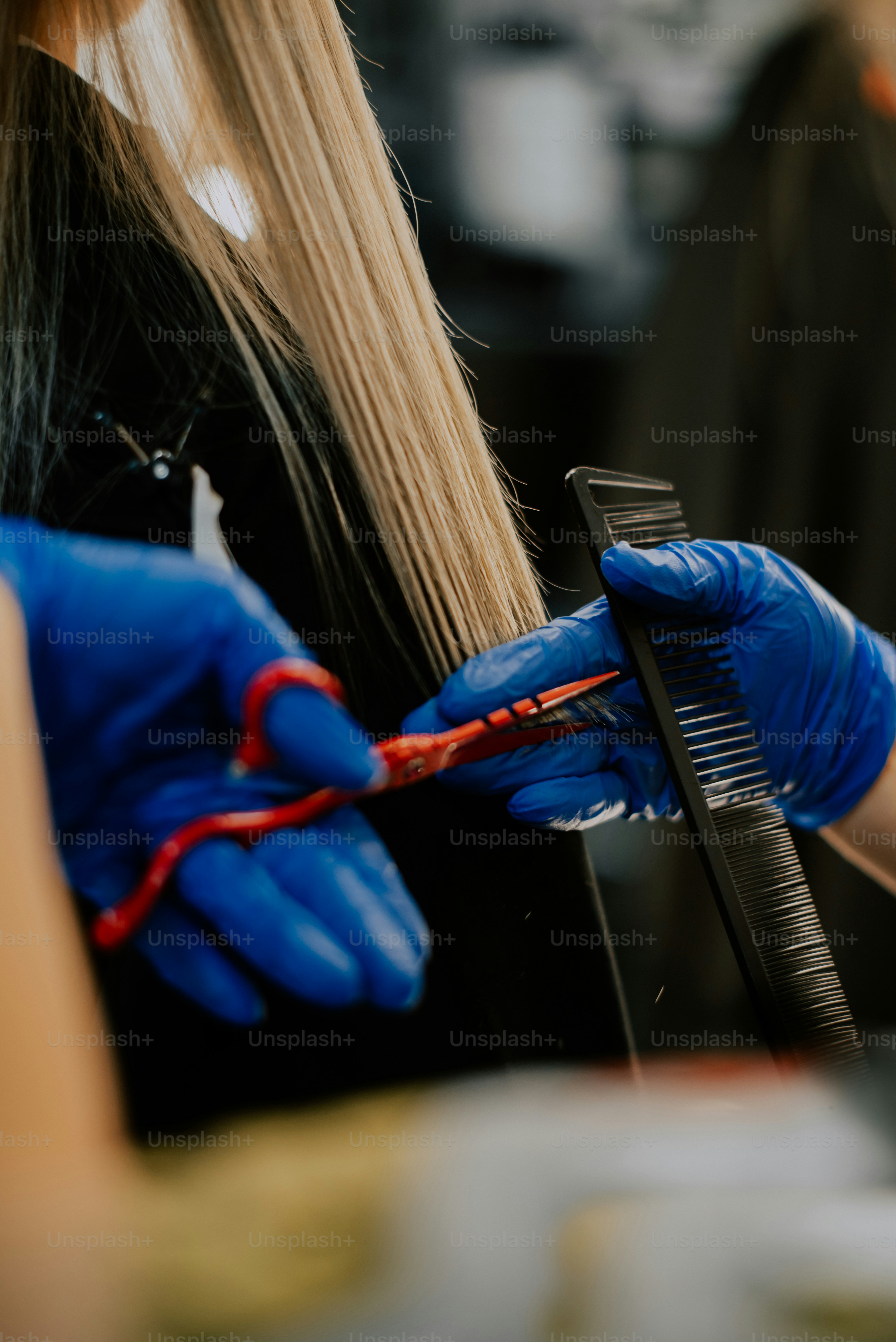 A woman wearing a blue garment photo – Hairdresser Image on Unsplash