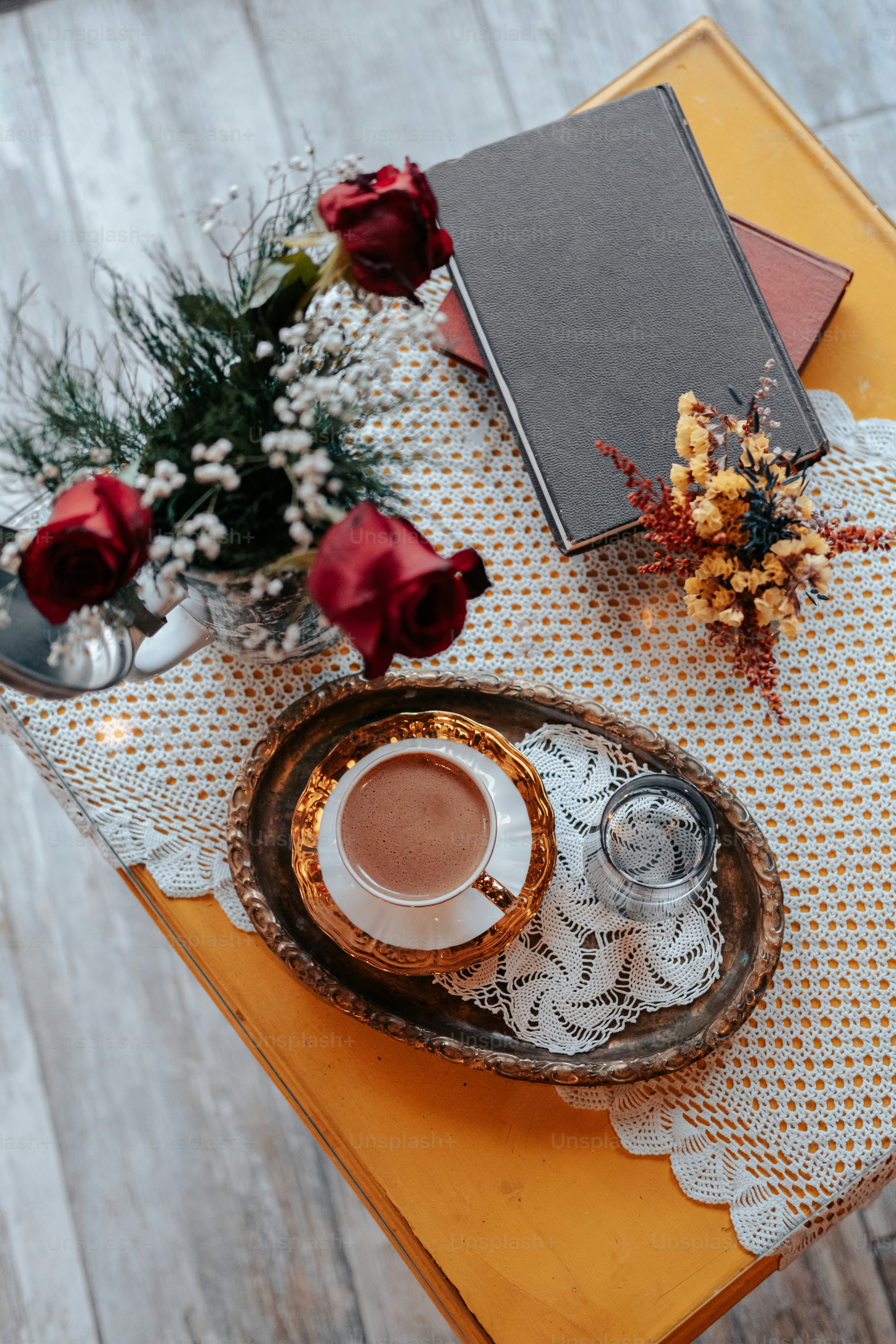 A table with flowers and a book photo – Tea Image on Unsplash