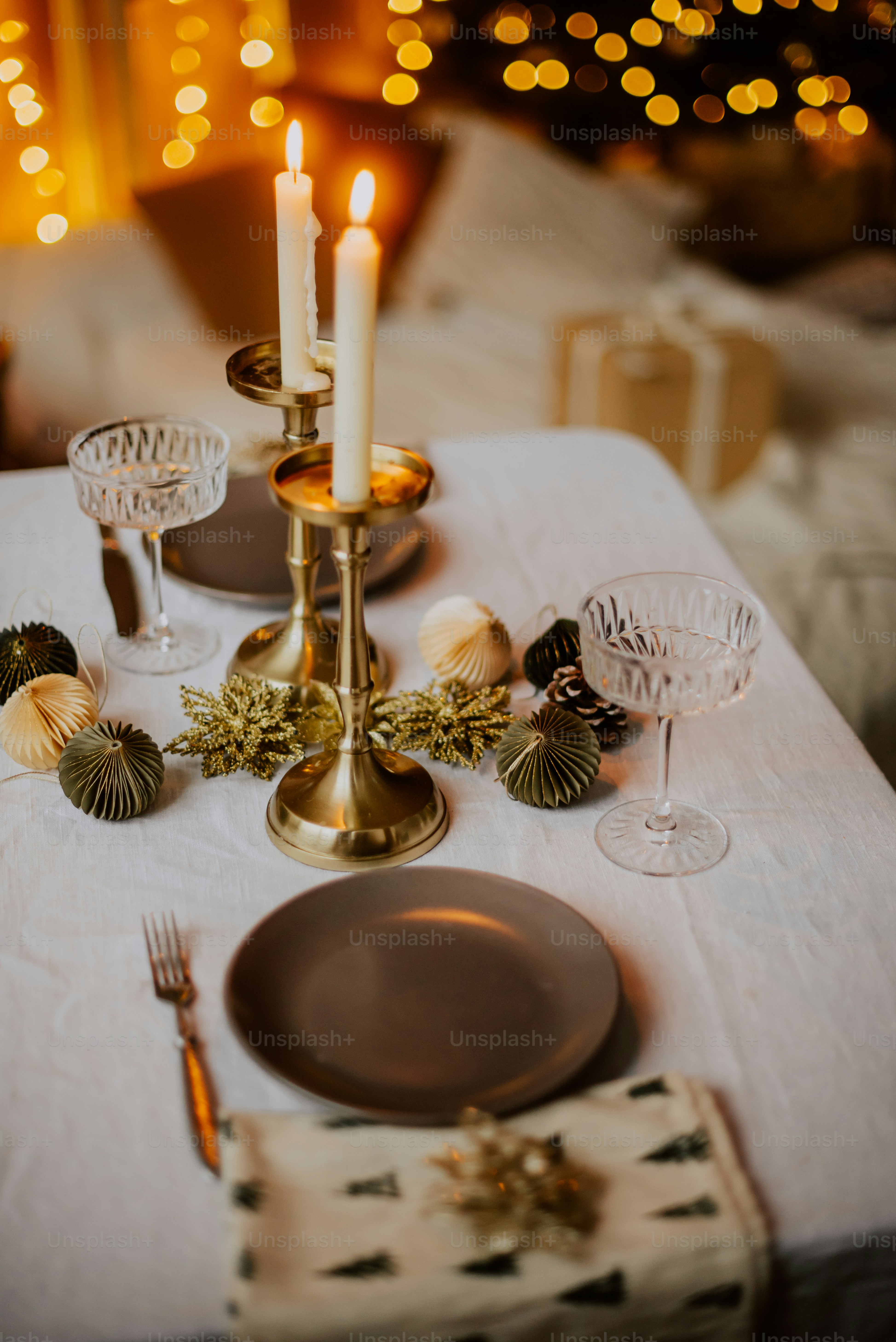 A table with candles and glasses photo – Candles Image on Unsplash
