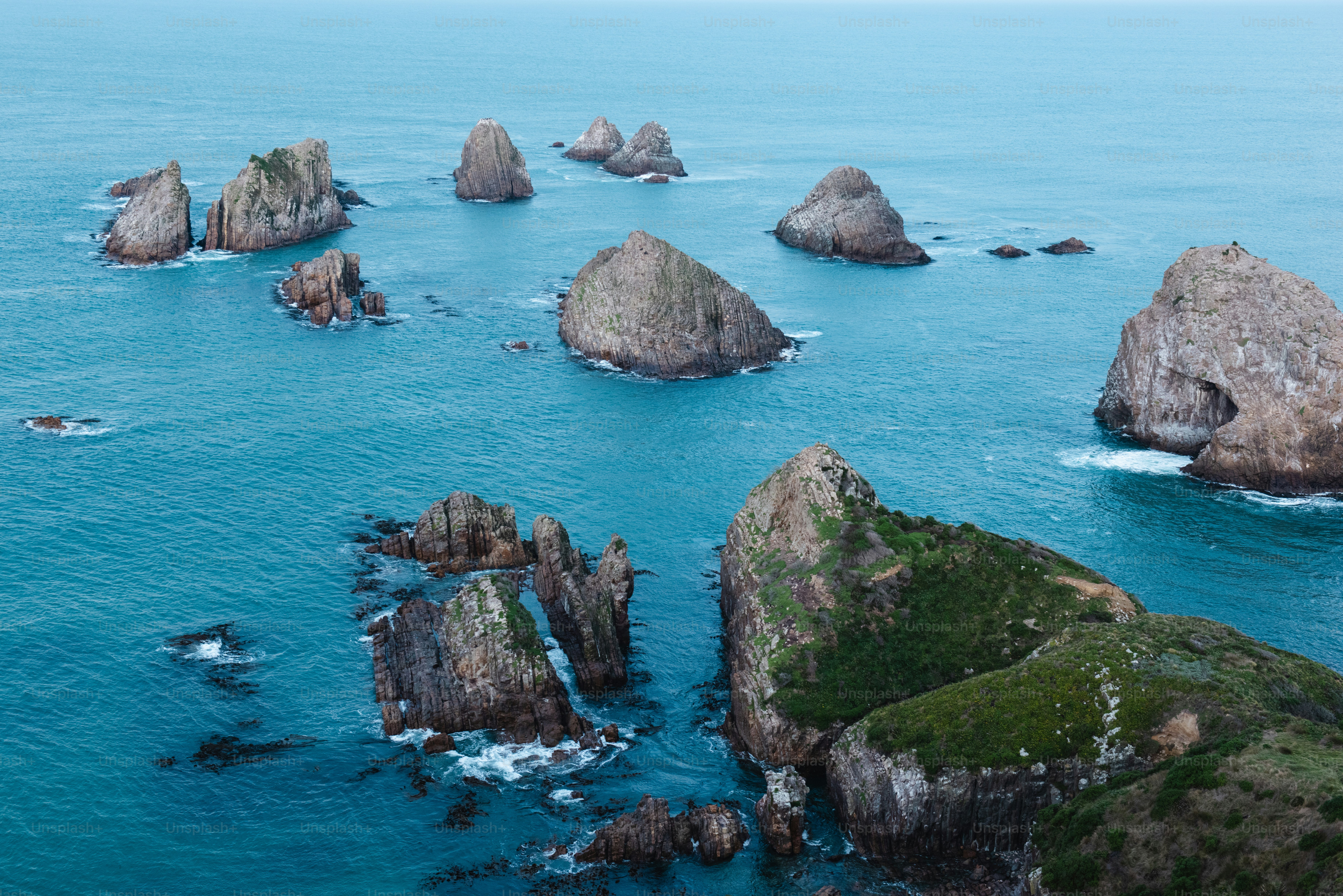 A group of rocks in the water photo – Hawaii Image on Unsplash