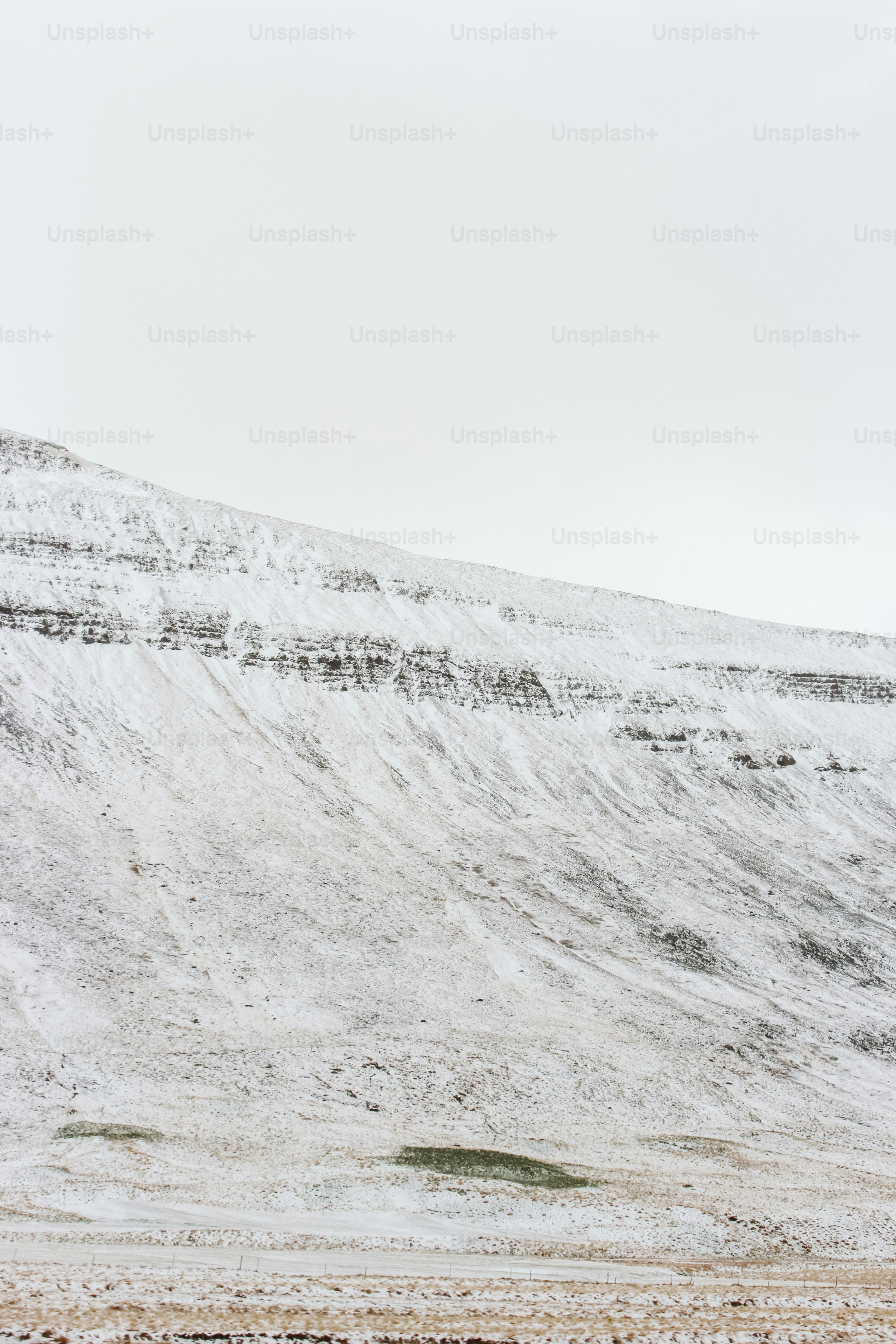 A large rocky hill photo – Winter Image on Unsplash