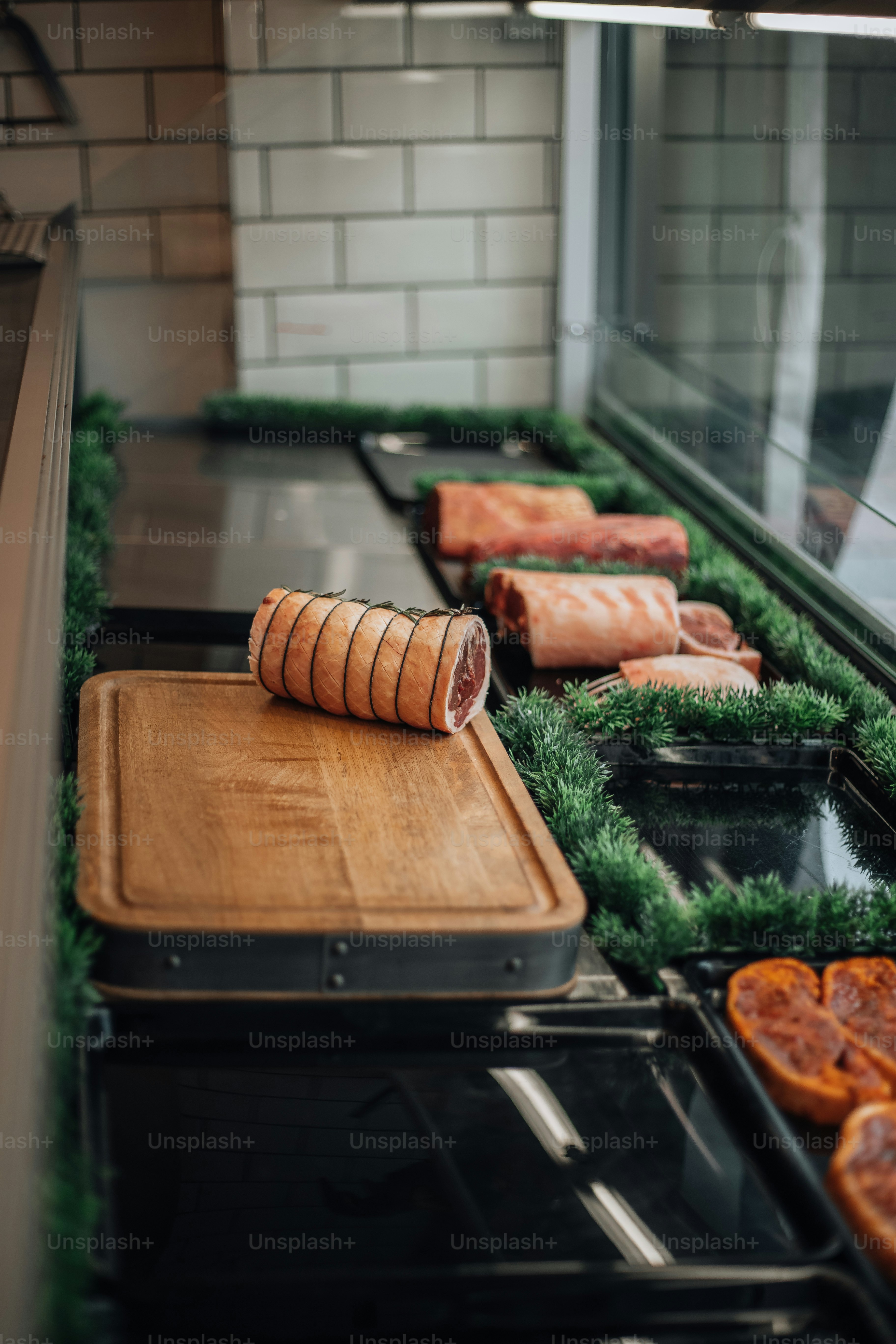 A grill with meats and vegetables photo – Window display Image on Unsplash