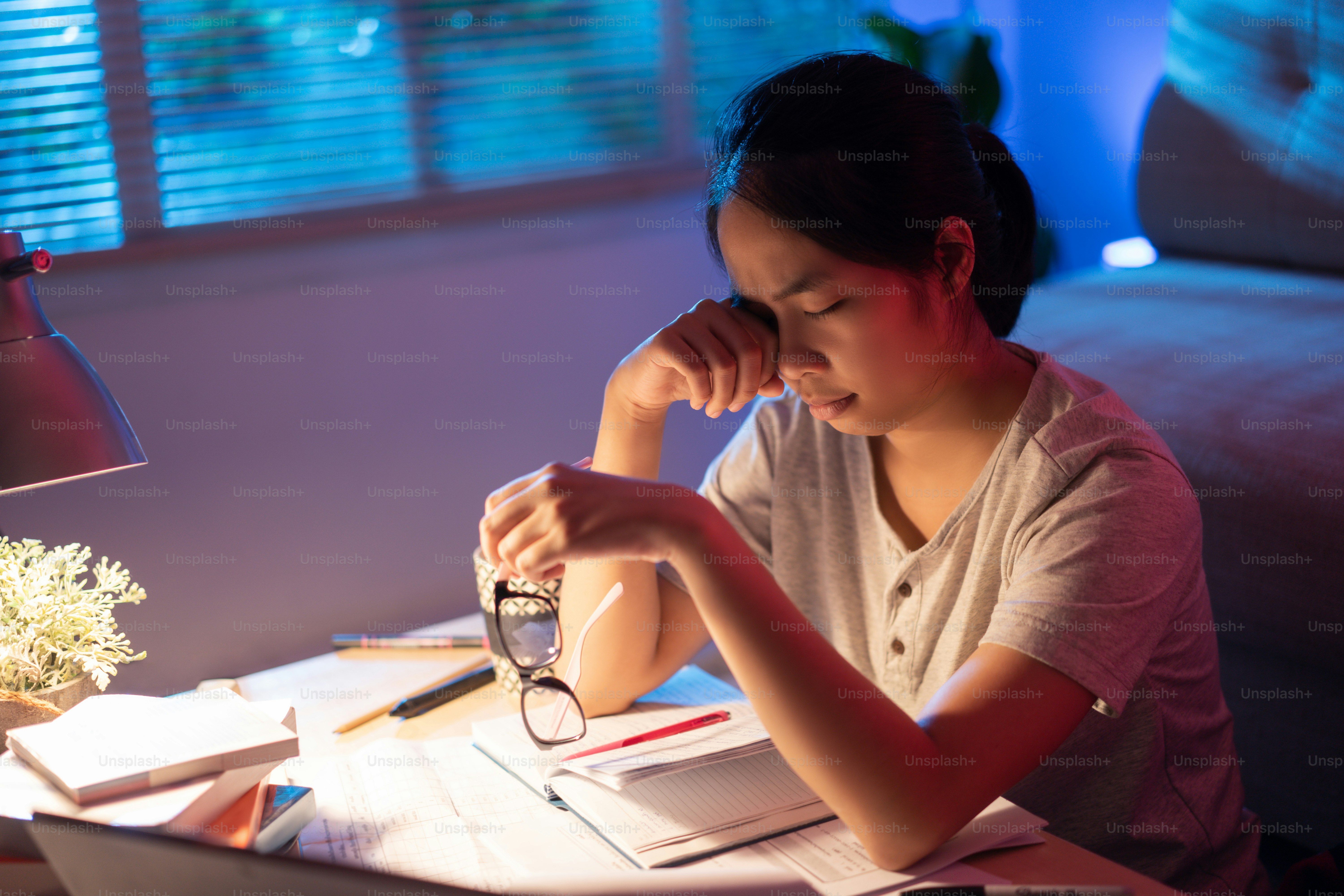 Asian women tired from working at home She felt sleepy yawning. photo – Deadline Image on Unsplash