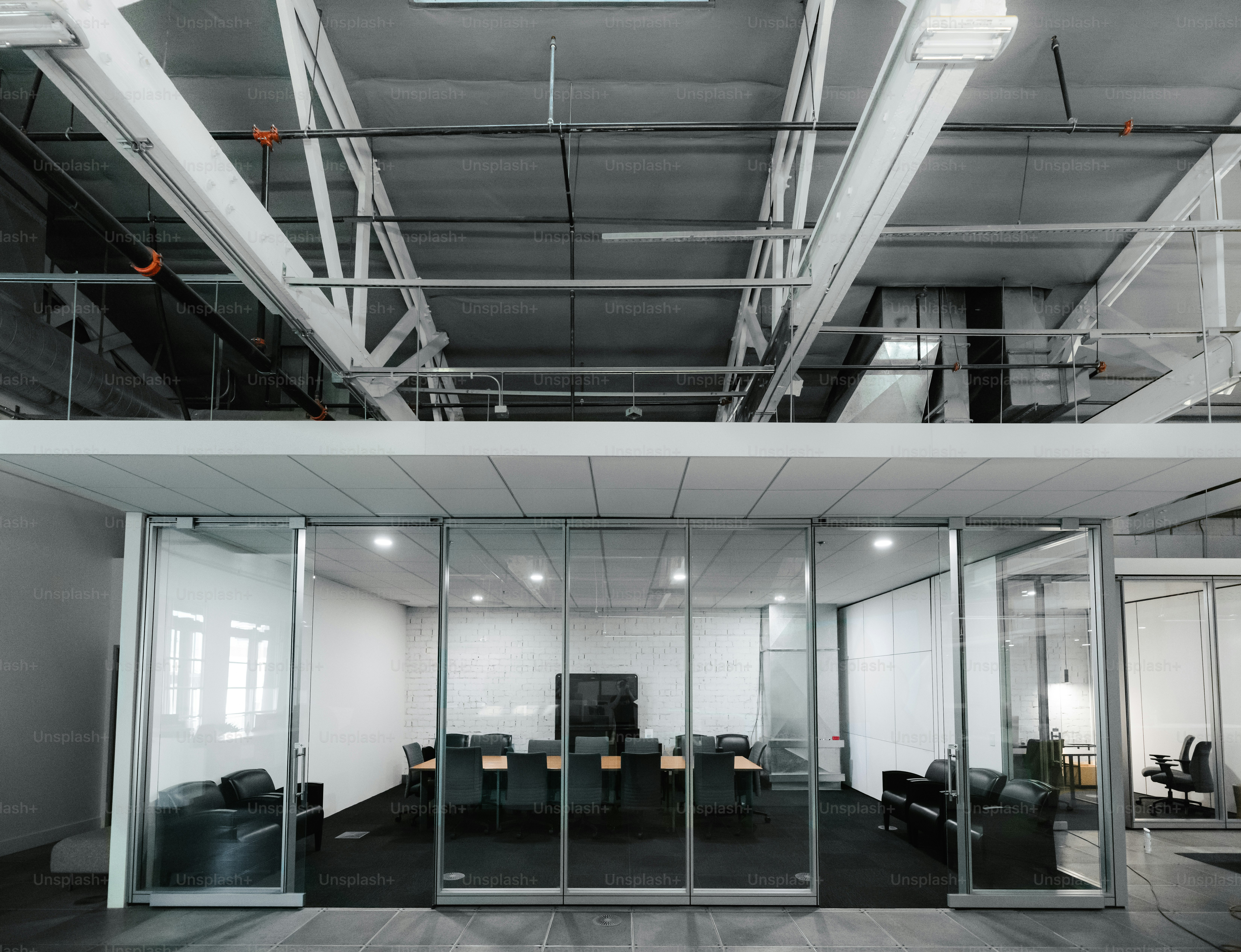 A glass walled office building photo – Office space Image on Unsplash